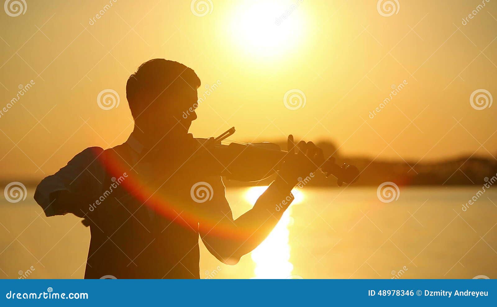 Male Violinist Playing the Violin at the Lake at Sunset Stock Footage ...