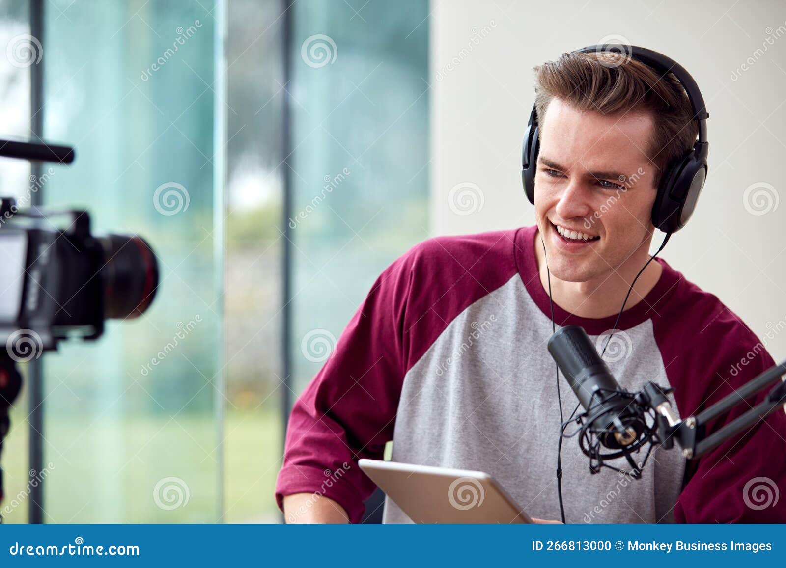 Male Vlogger with Digital Tablet Recording Video at Home with Camera ...