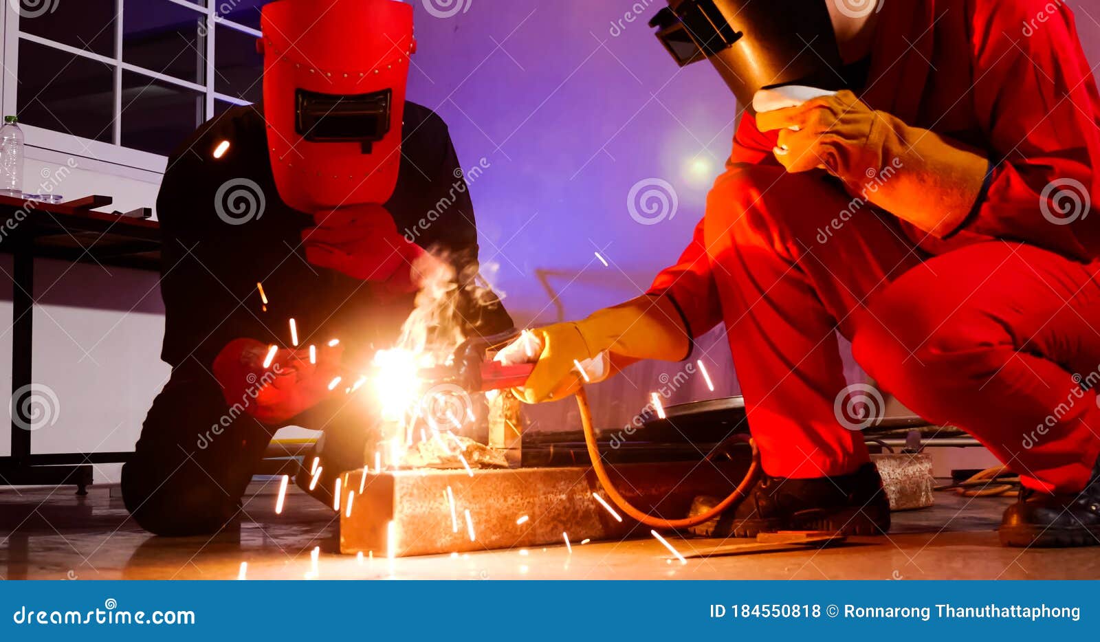 Male Welders Working Together at Site Stock Photo - Image of industrial ...