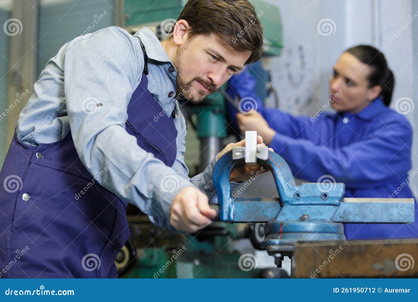 Male Worker Adjusting Clamp on Vice Stock Photo - Image of business ...