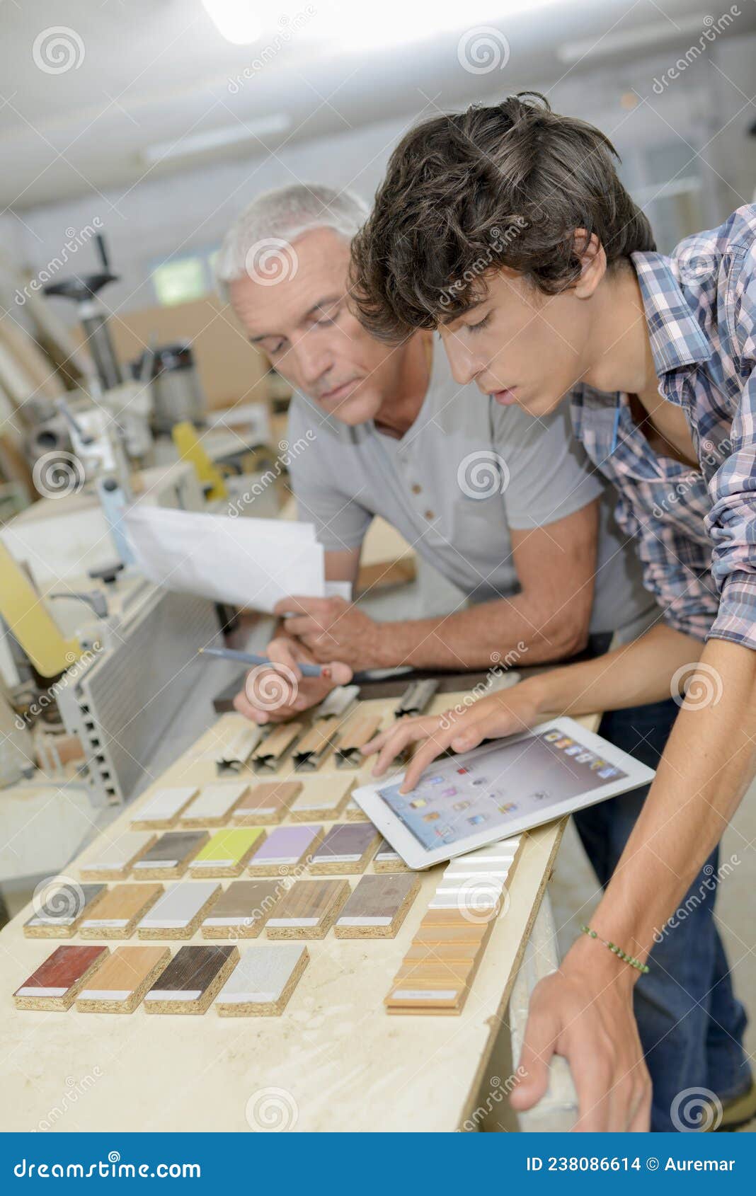 Male Worker Bonding in Workshop Stock Photo - Image of young, colour ...