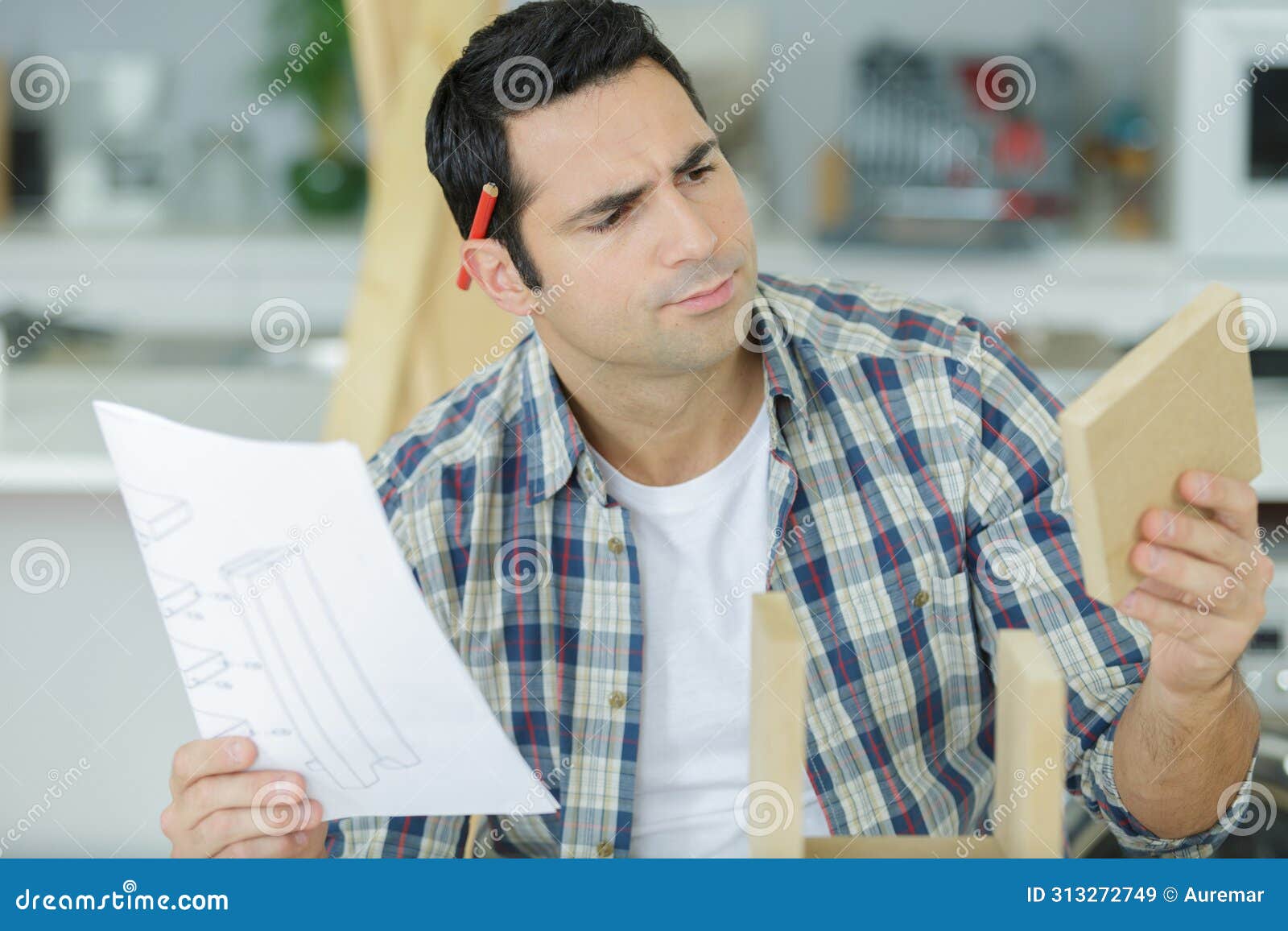 Male worker checking plan stock image. Image of assembly - 313272749