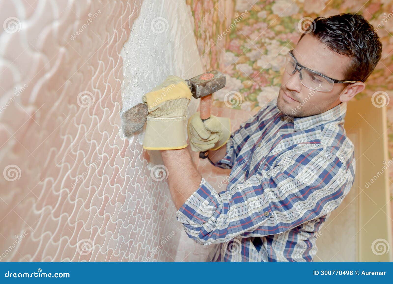 Male worker chiseling wall stock photo. Image of glasses - 300770498