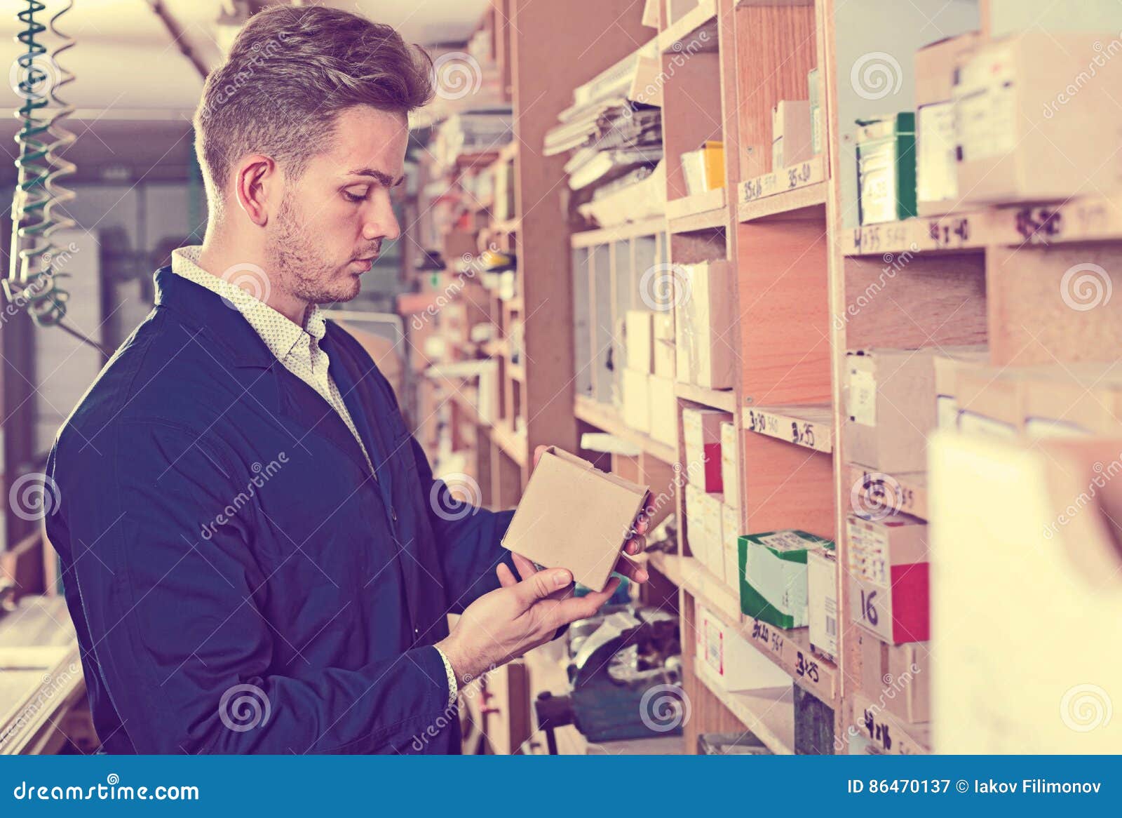 Male Worker Choosing Items for Work Stock Image - Image of keeping ...