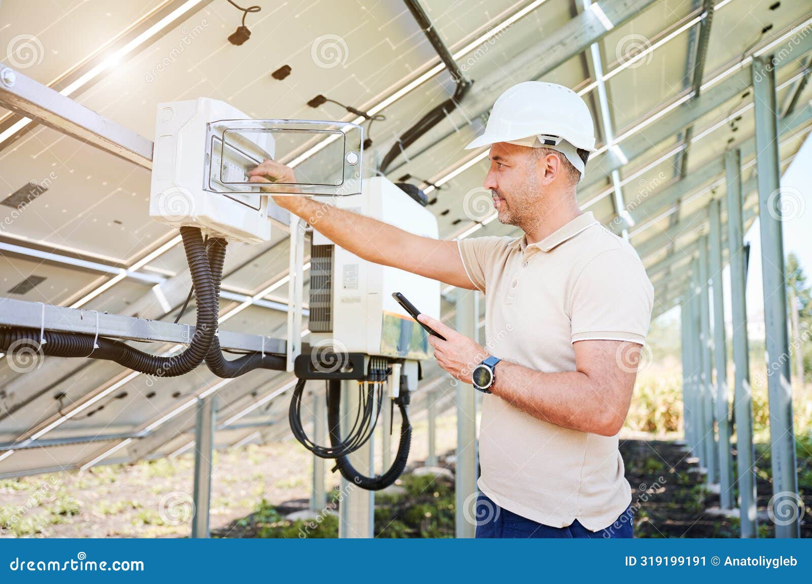 Male Worker Configuring Solar Panel According To Instructions. Stock ...