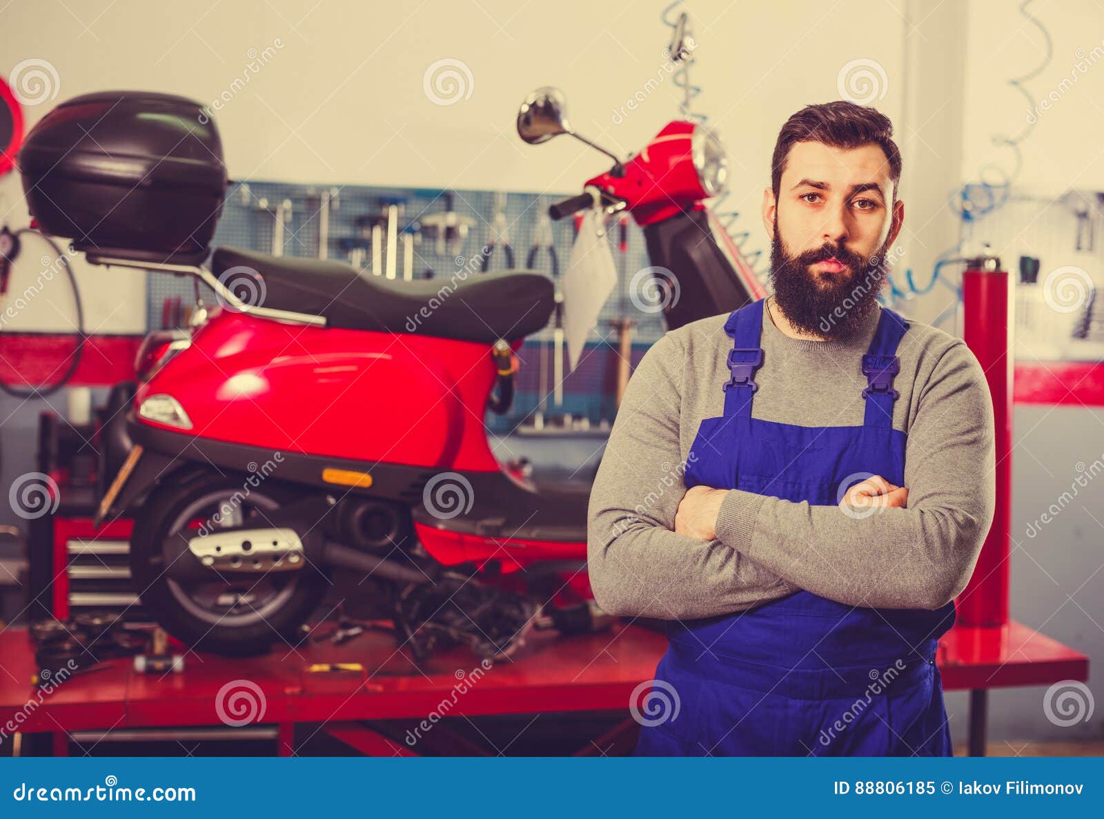 Male Worker Demonstrating Motorbikes and Scooters Stock Image - Image ...