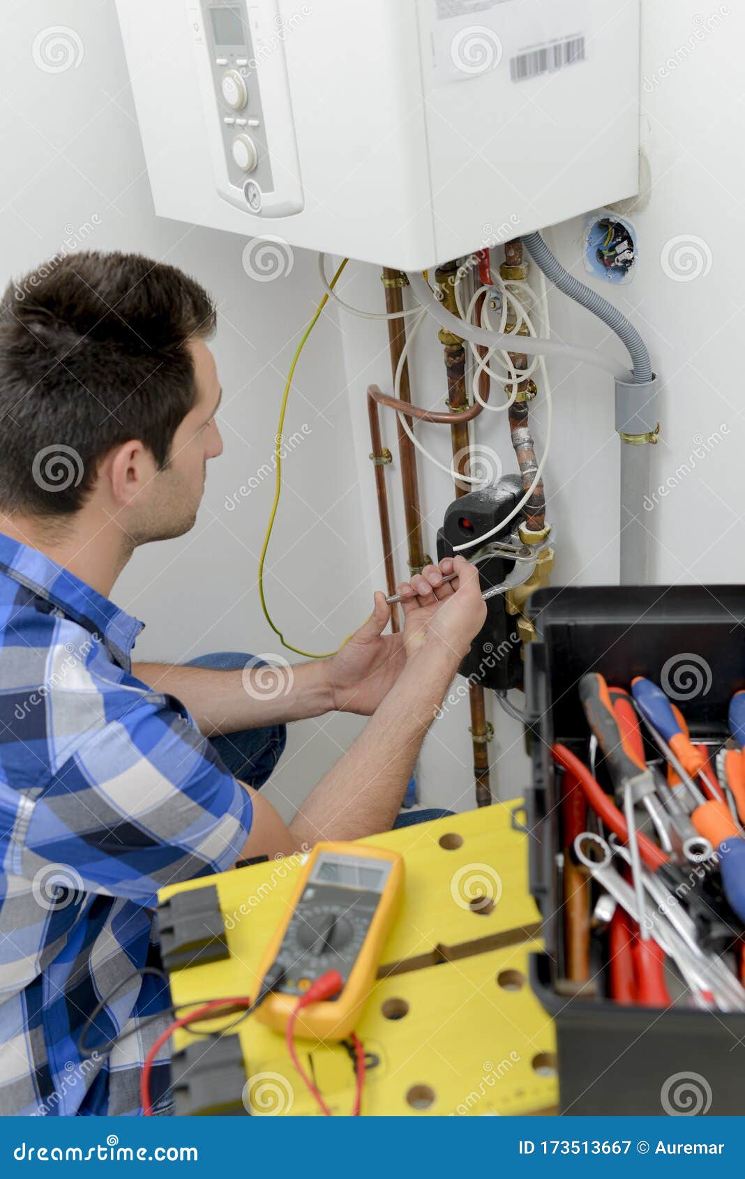 Male worker fitting boiler stock image. Image of multimeter - 173513667