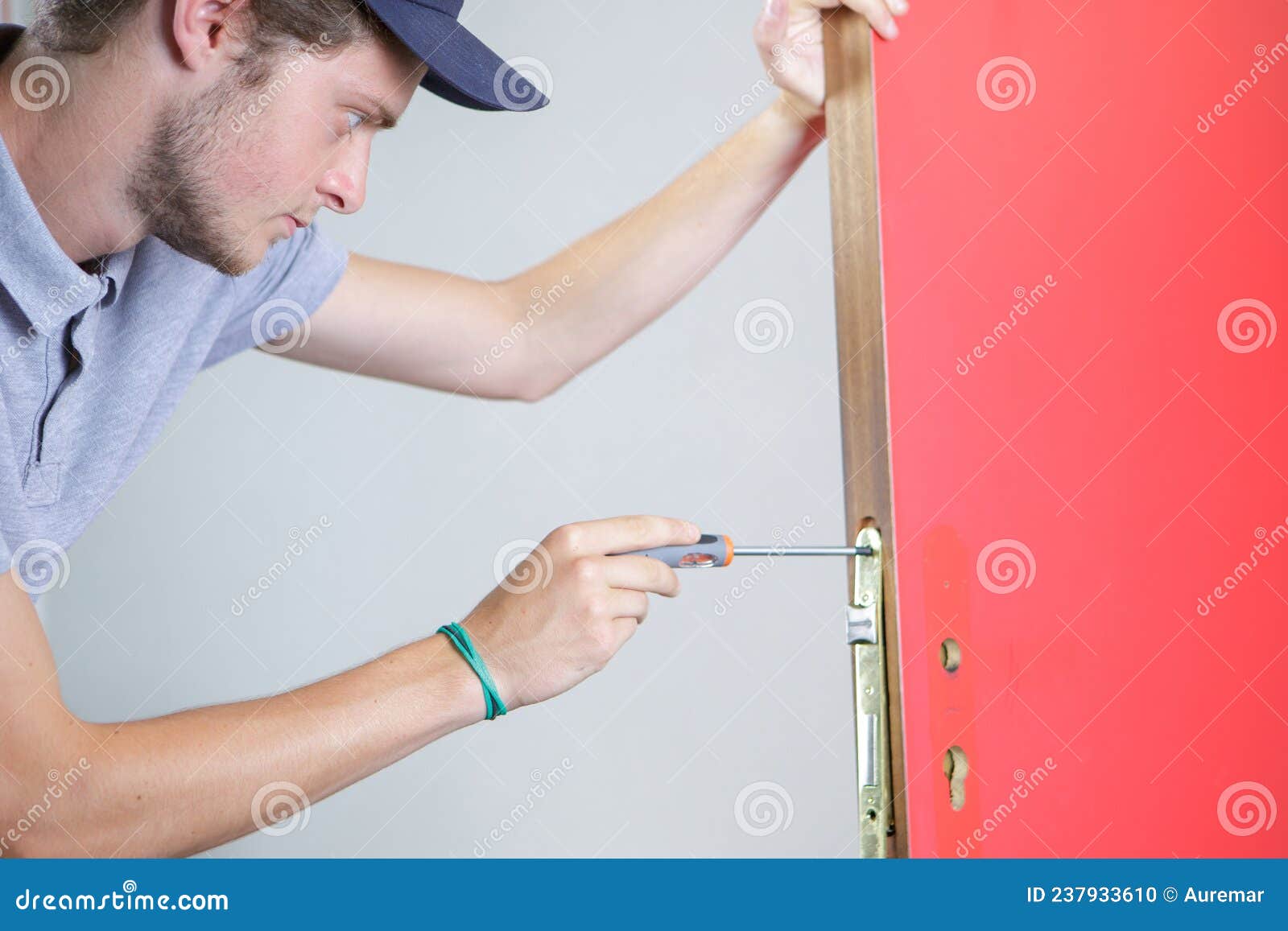 Male worker fixing lock stock photo. Image of office - 237933610