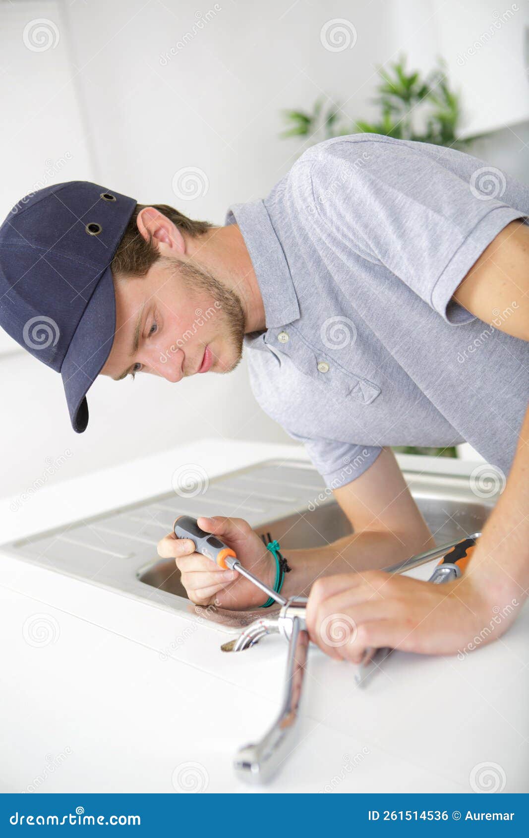 Male worker fixing tube stock photo. Image of vocational - 261514536
