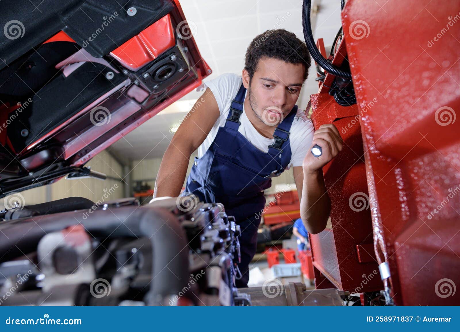 Male worker in garage stock image. Image of occupation - 258971837
