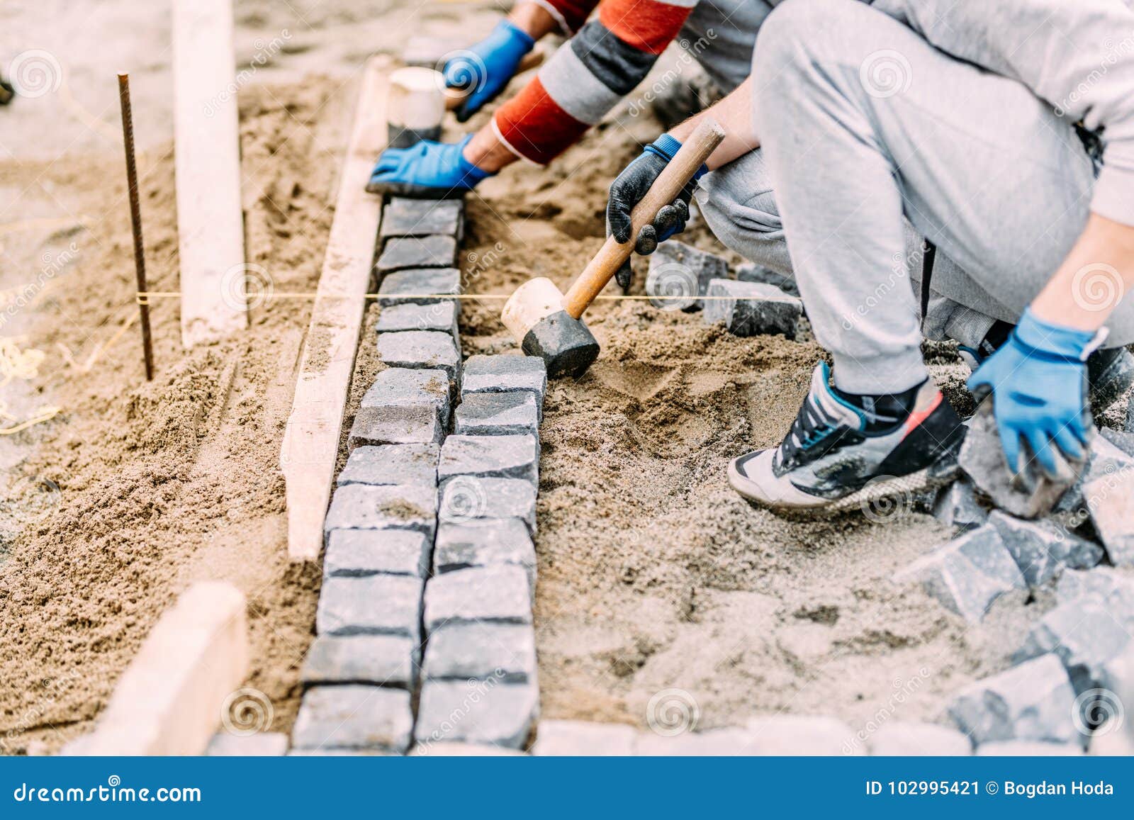 Worker, Handyman And Construction Worker Installing Cobblestone ...
