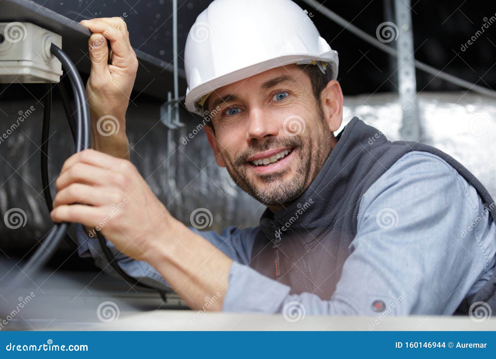 Male Worker Installing Mounting Clips in Concrete Ceiling Stock Photo ...