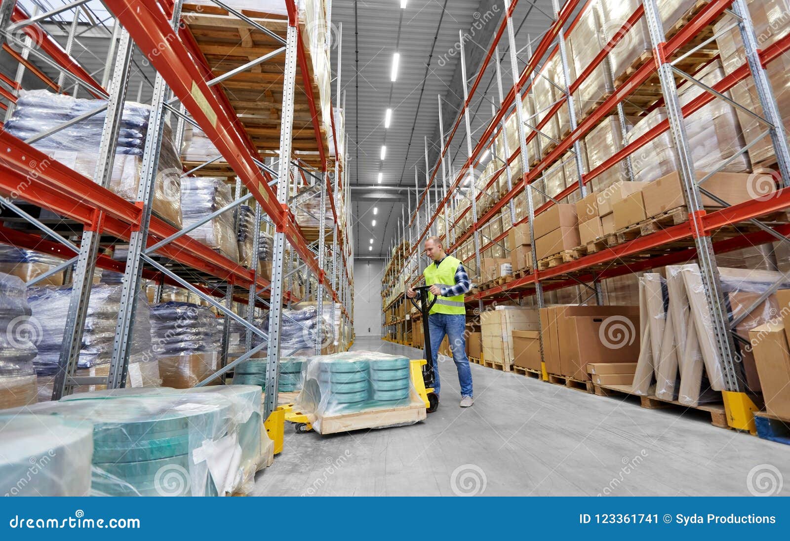 Male Worker with Loader Working at Warehouse Stock Image - Image of ...