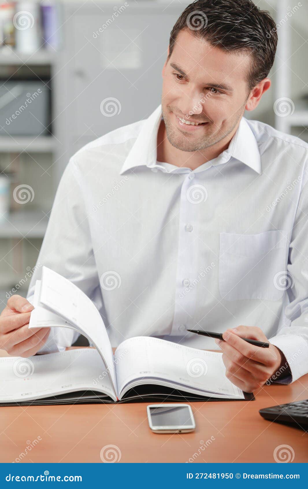 Male Worker Making Appointment Stock Photo - Image of desk ...