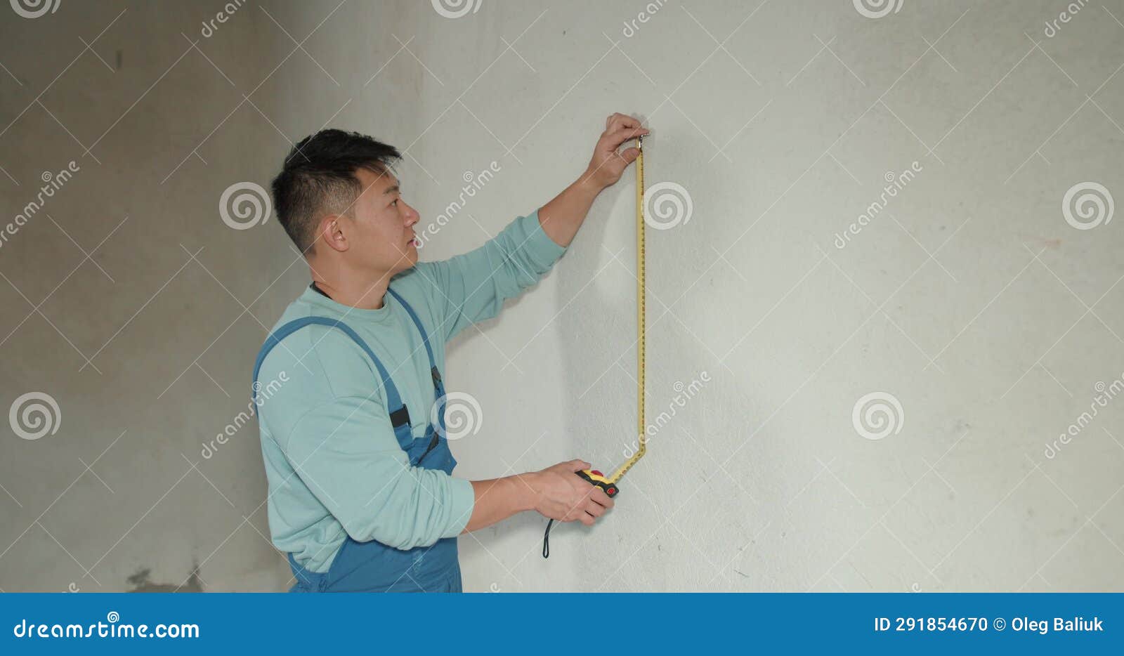 Male Worker Measuring the Wall with a Tape Stock Footage - Video of ...