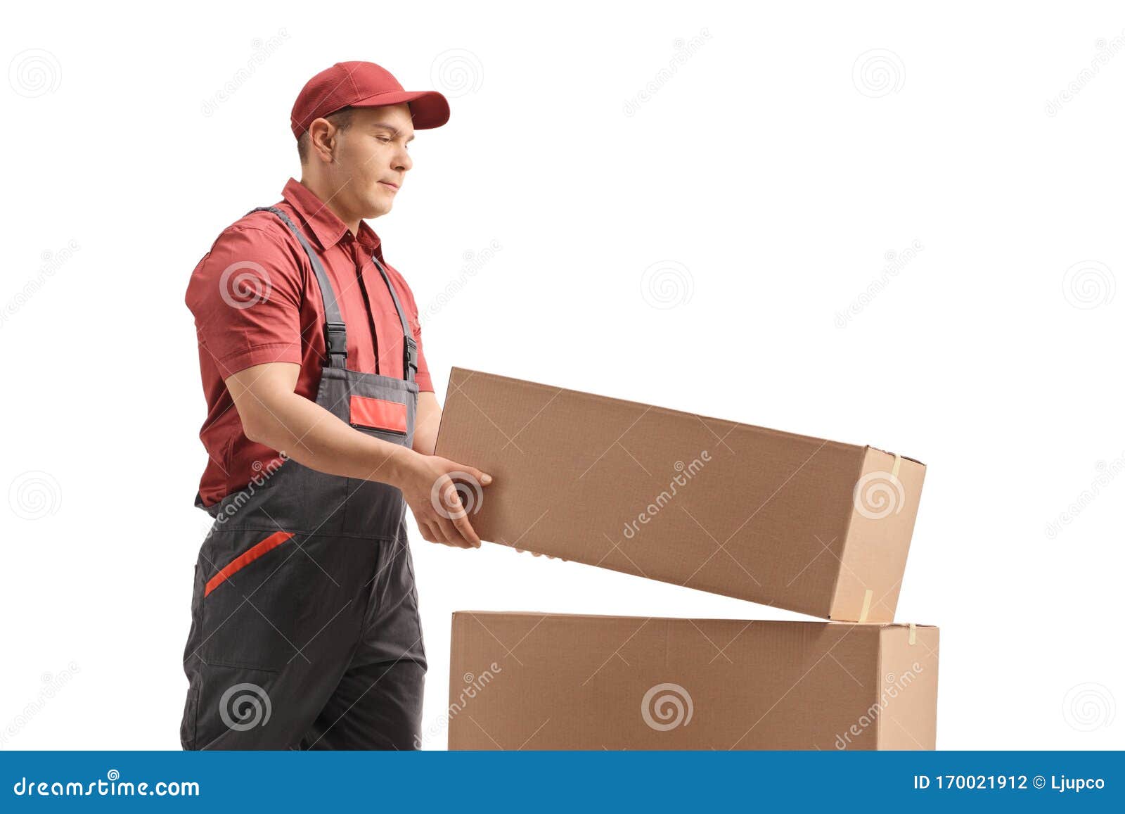 Male Worker Placing a Box on Top of a Stack Stock Photo - Image of ...