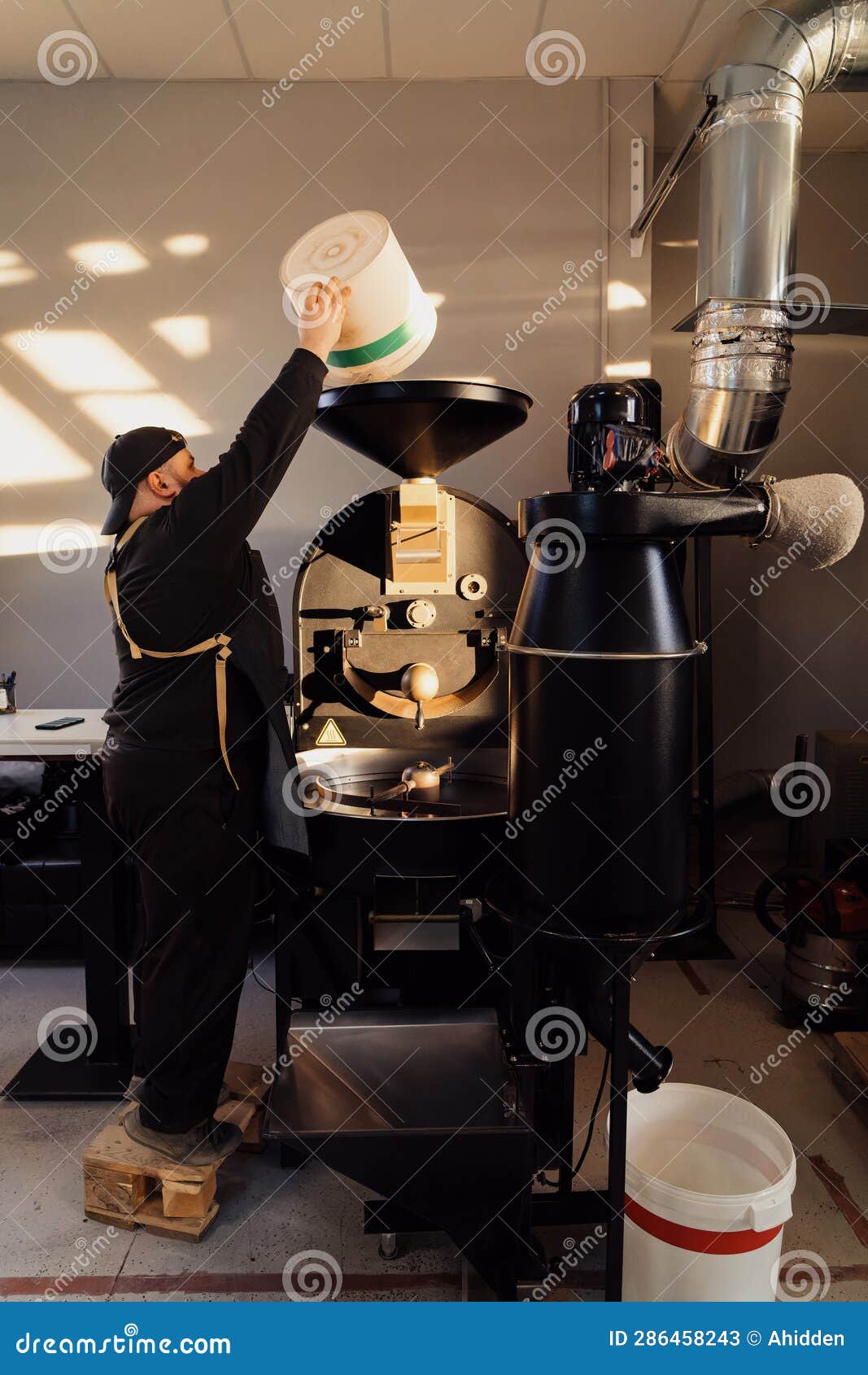 Male Worker Pouring Coffee Beans into Roasting Machine Stock Image ...