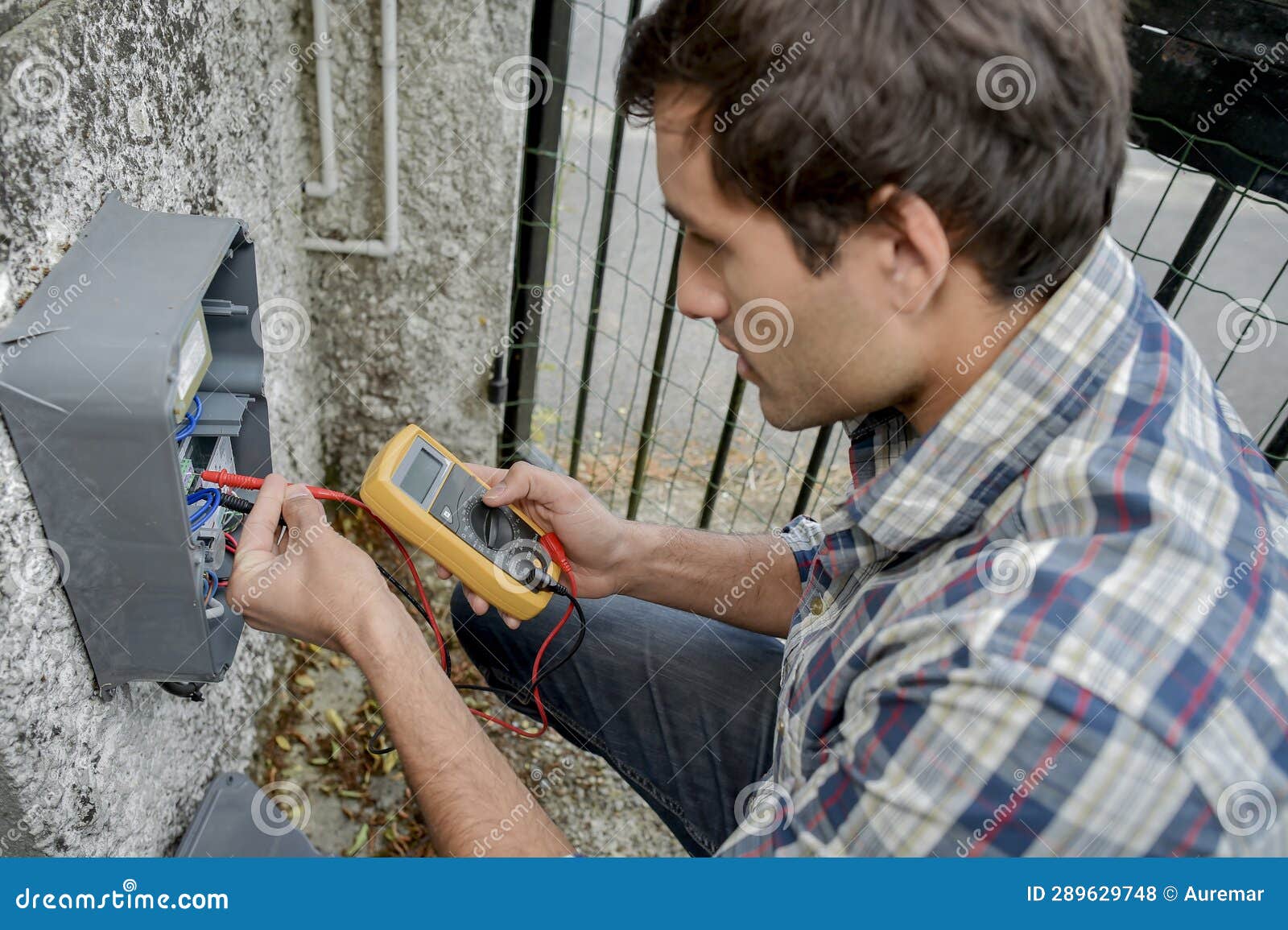 Male worker reading meter stock photo. Image of outdoors - 289629748