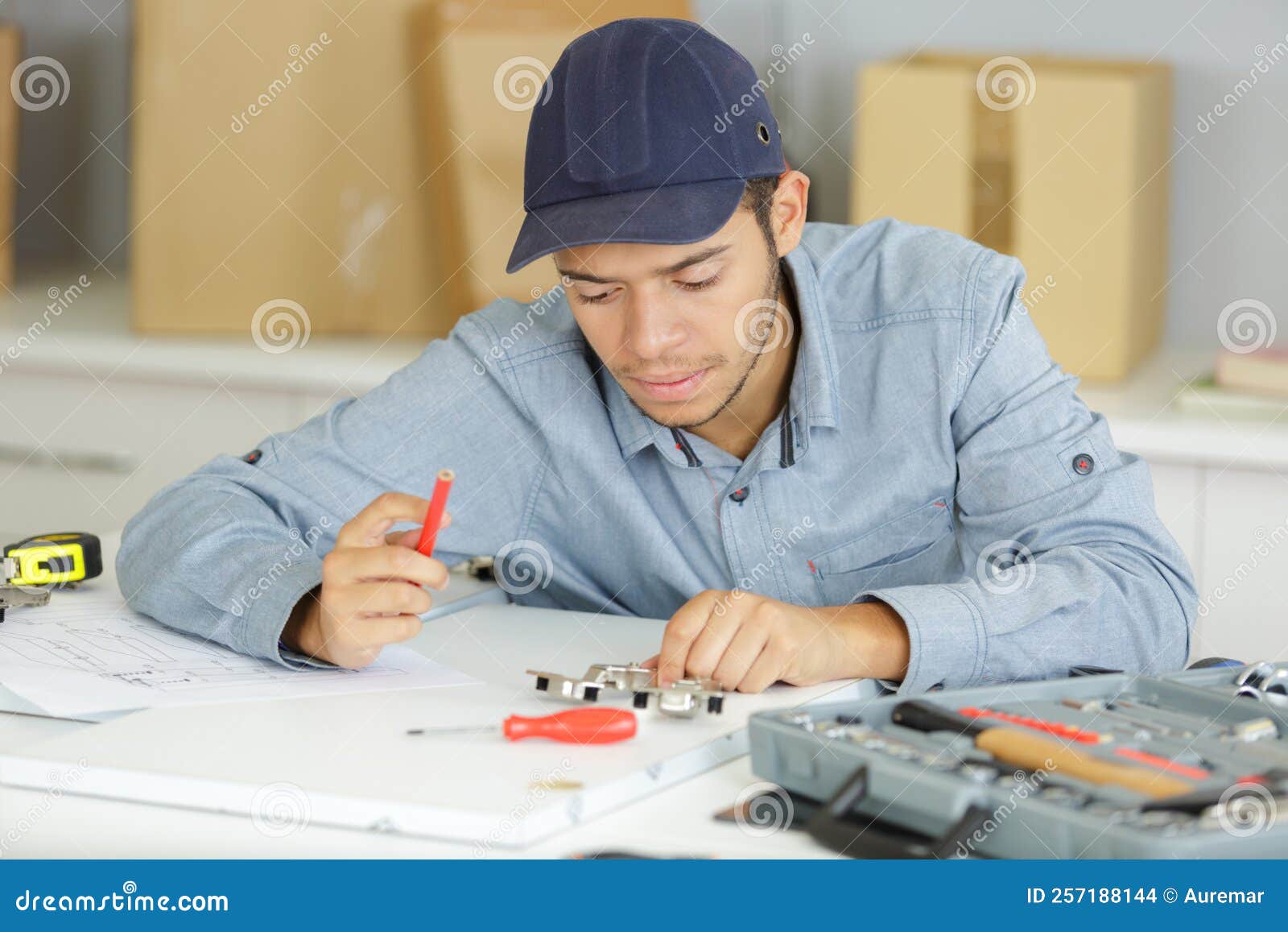 Male Worker Repairing Something Stock Photo - Image of finger, arrange ...