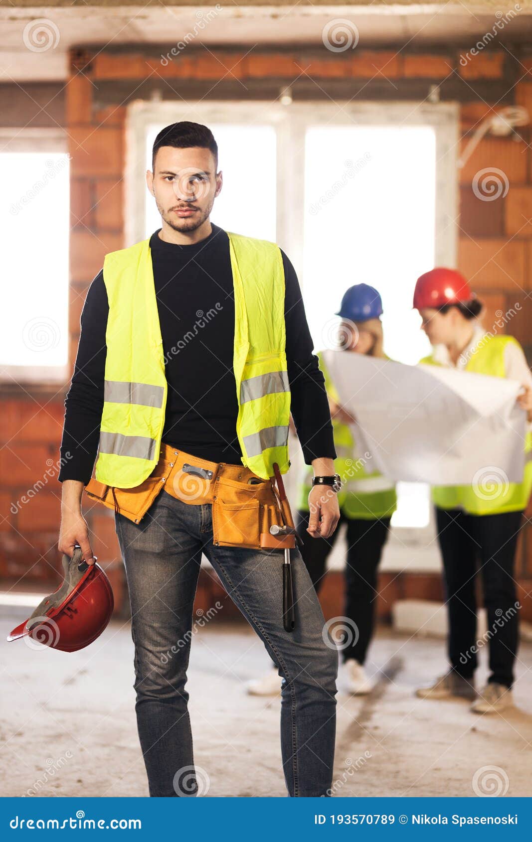 Male Worker on a Residential Construction Site with His Team of ...