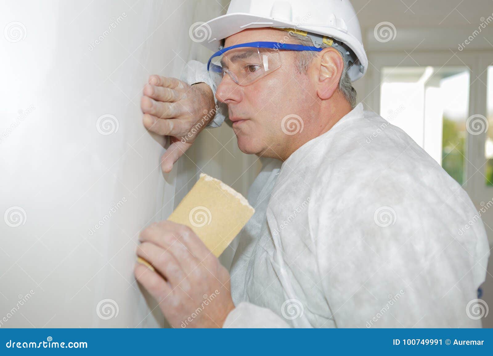 Male Worker Sand Papering Wall Stock Image - Image of building ...