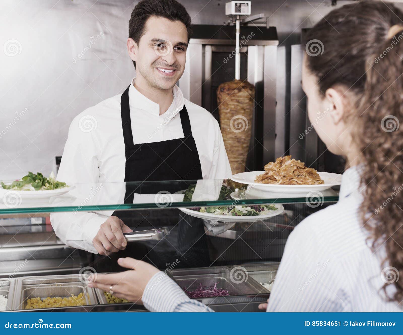 Male Worker Serving Customer Stock Image - Image of assistant, female ...