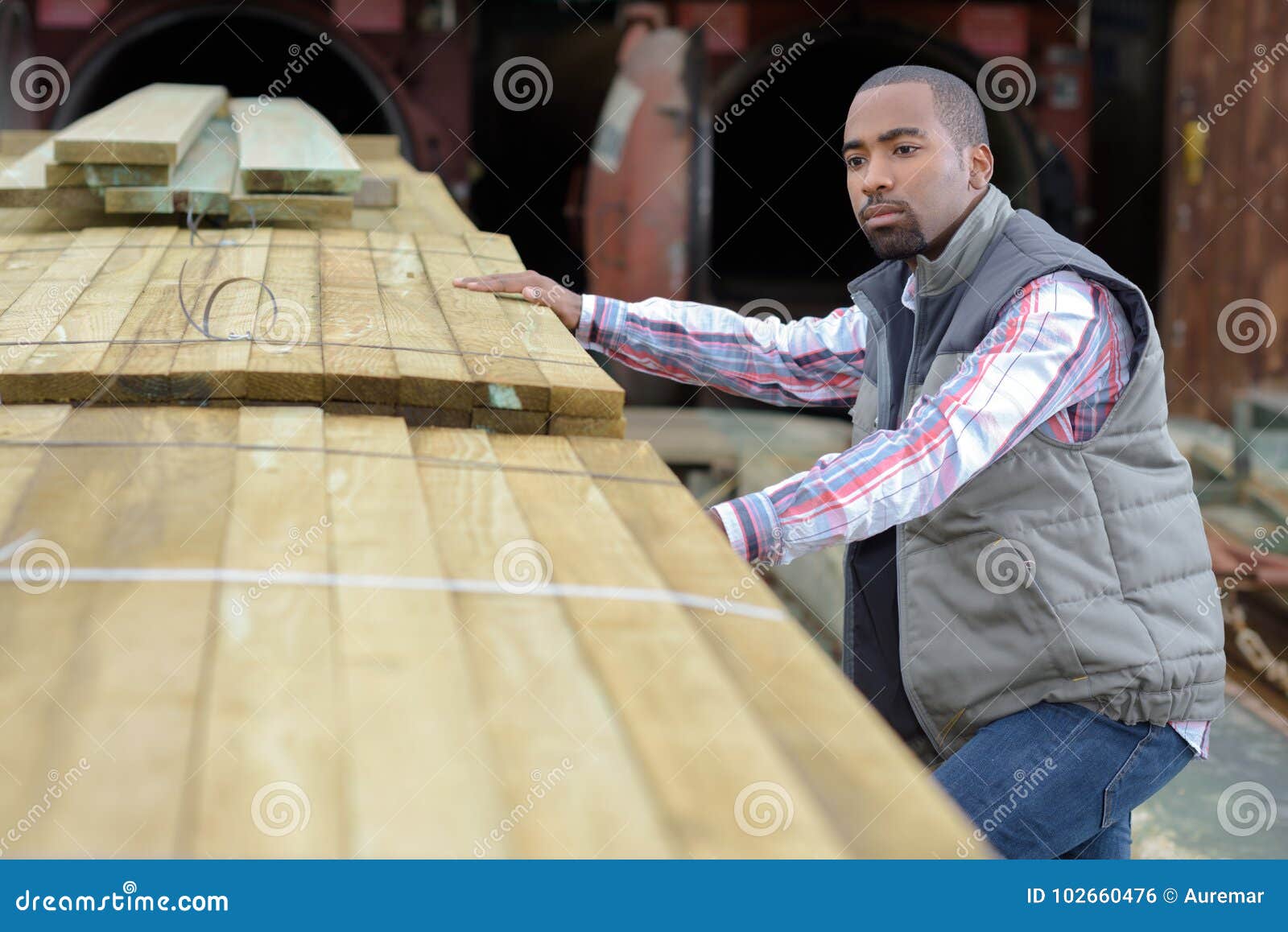 Male worker by stack wood stock photo. Image of finished - 102660476