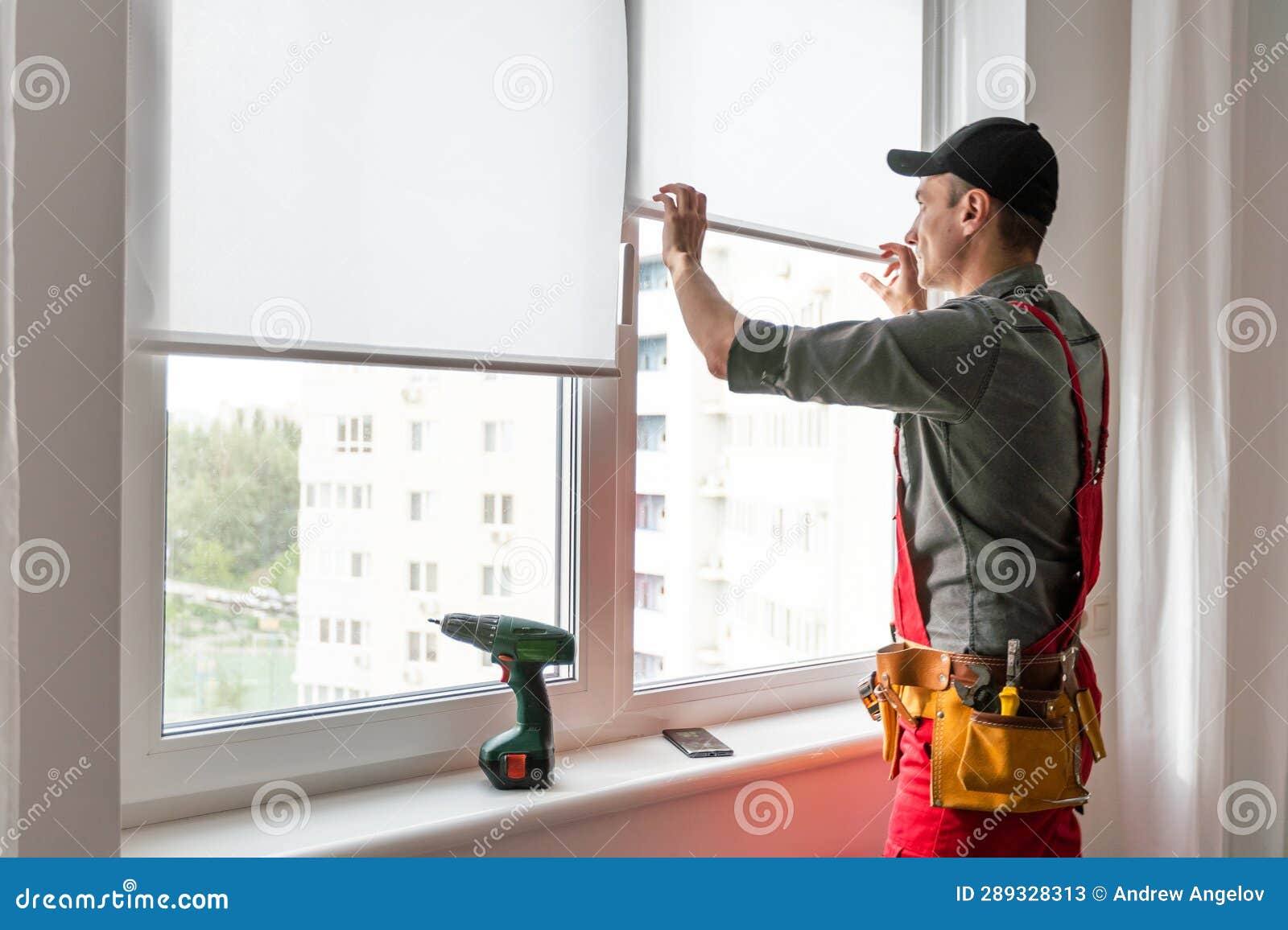 Male Worker Taking Measurements of Window in Flat Stock Image - Image ...
