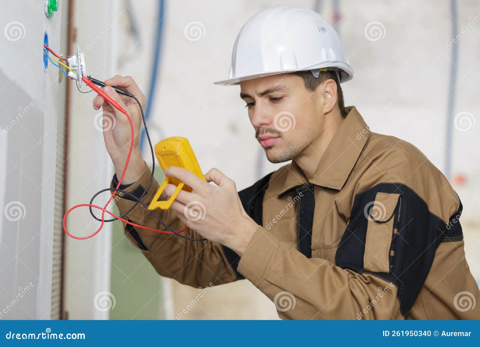 Male Worker Testing Wall Socket with Multimeter Stock Photo - Image of ...