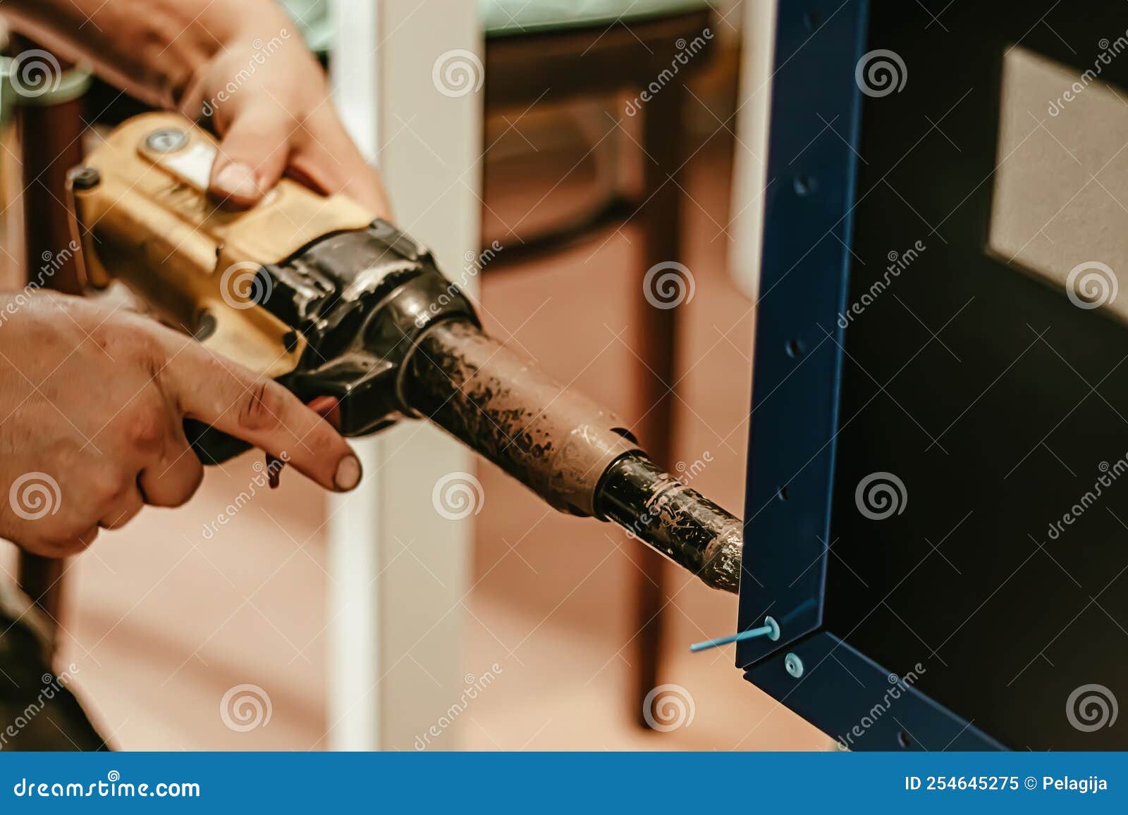 Male Worker Uses Electric Riveting Gun. Hand Holding Riveting M Stock ... Male Worker Uses Electric Riveting Gun. Hand Holding Riveting M Stock ...