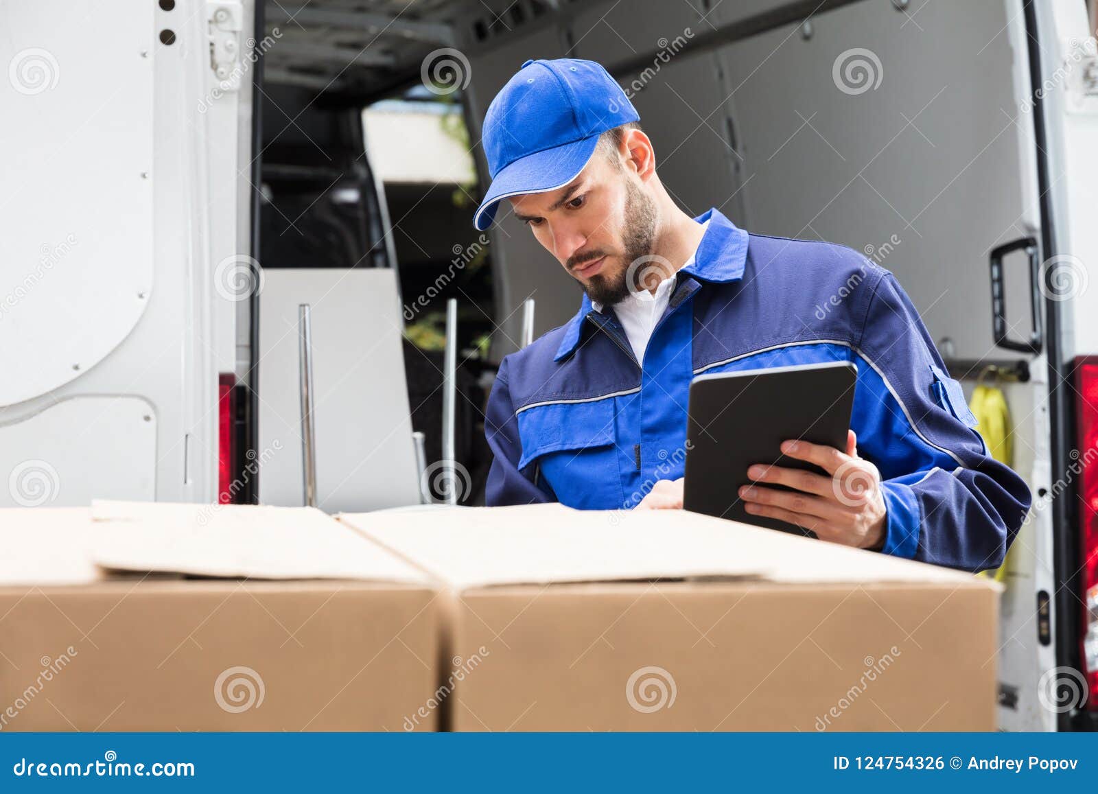 Male Worker Using Tablet stock photo. Image of happy - 124754326