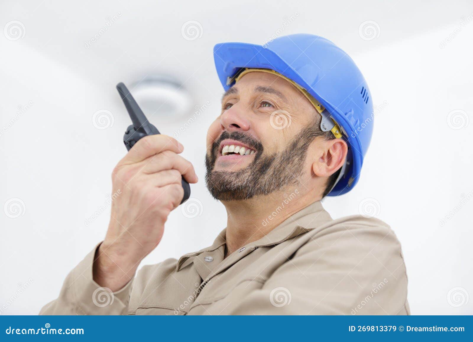 Male Worker Using Walkie-talkie with Colleague Stock Image - Image of ...