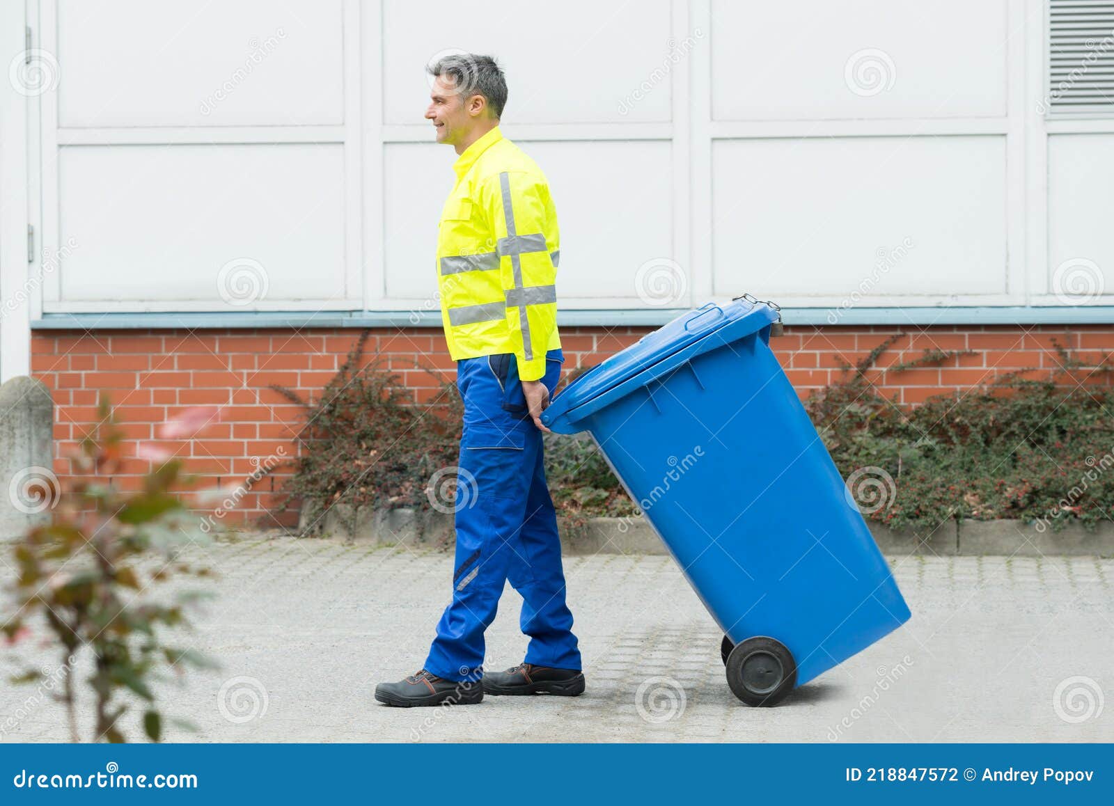 Male Worker Walking with Dustbin on Street Stock Photo - Image of ...