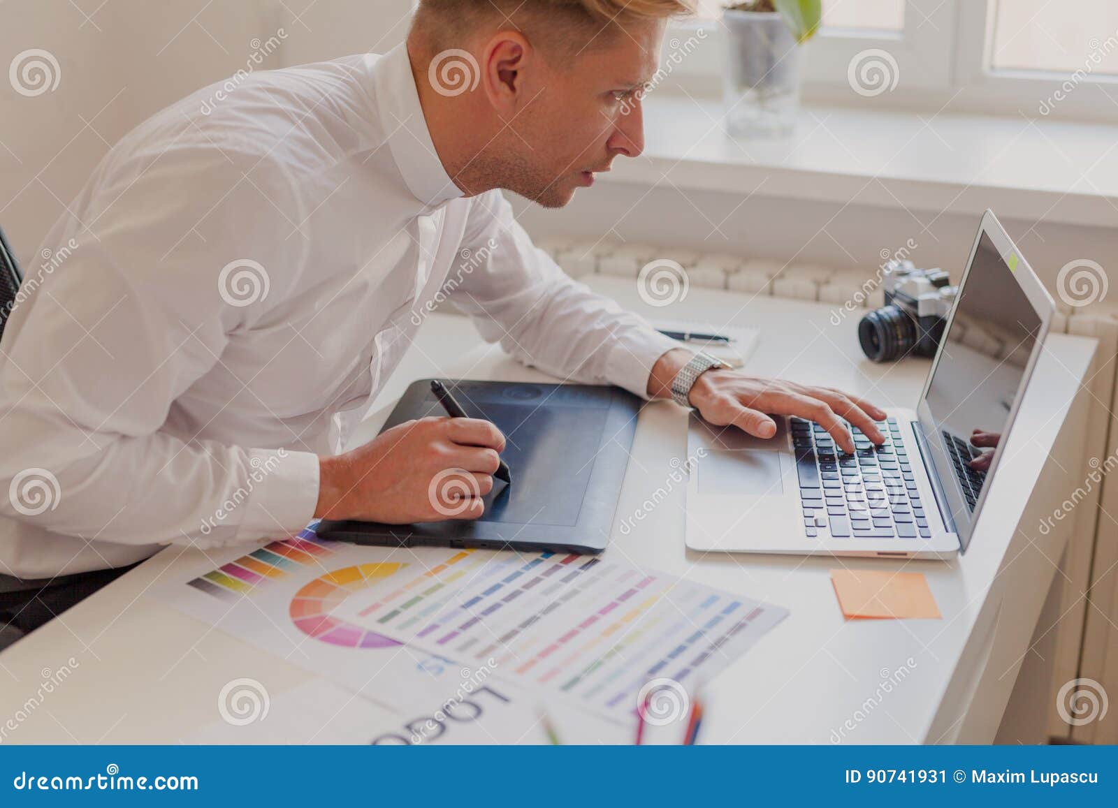 Male working at desktop stock image. Image of creative - 90741931