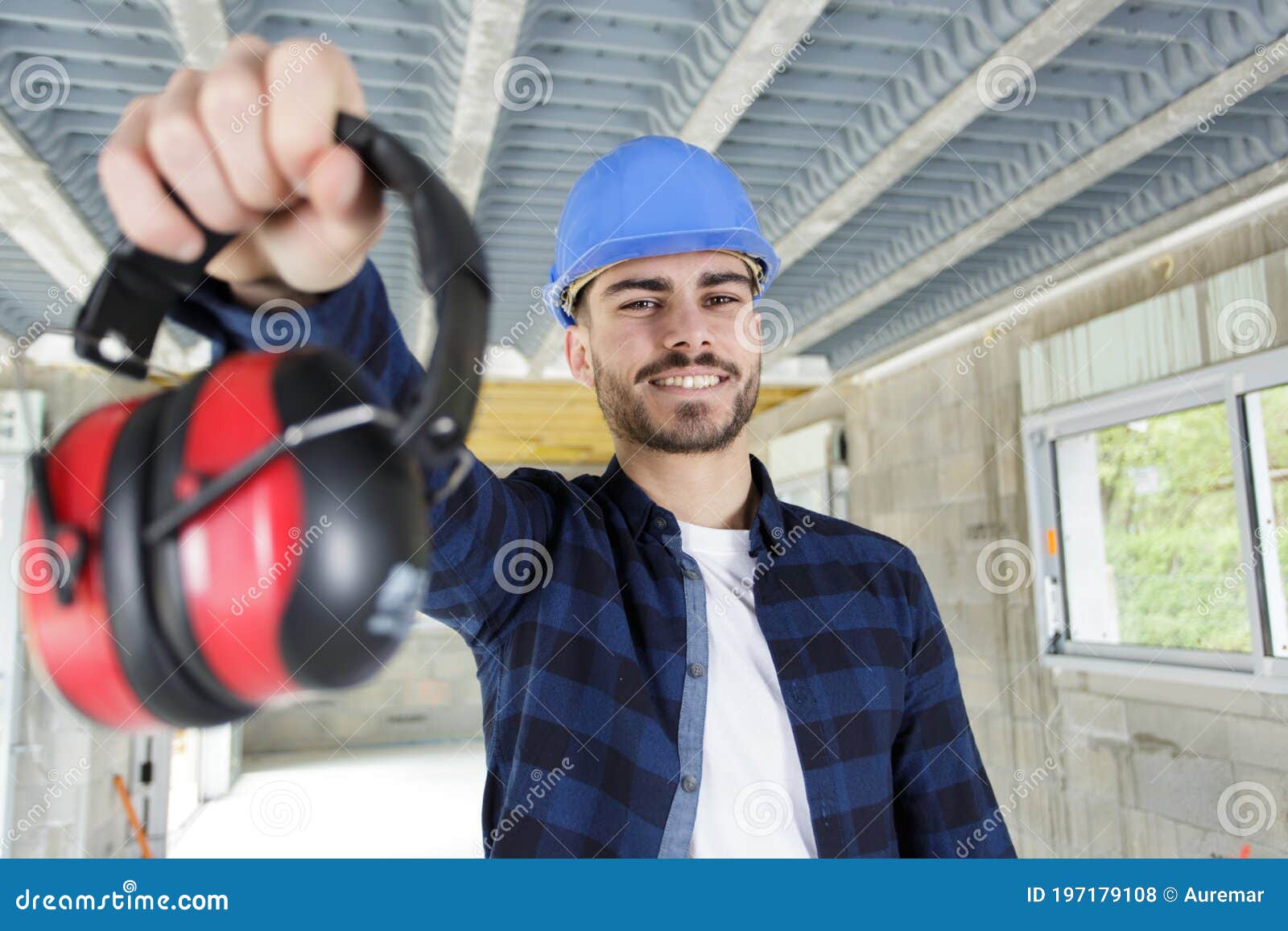 Male Working Proffering Ear Defenders Stock Photo - Image of proffer ...