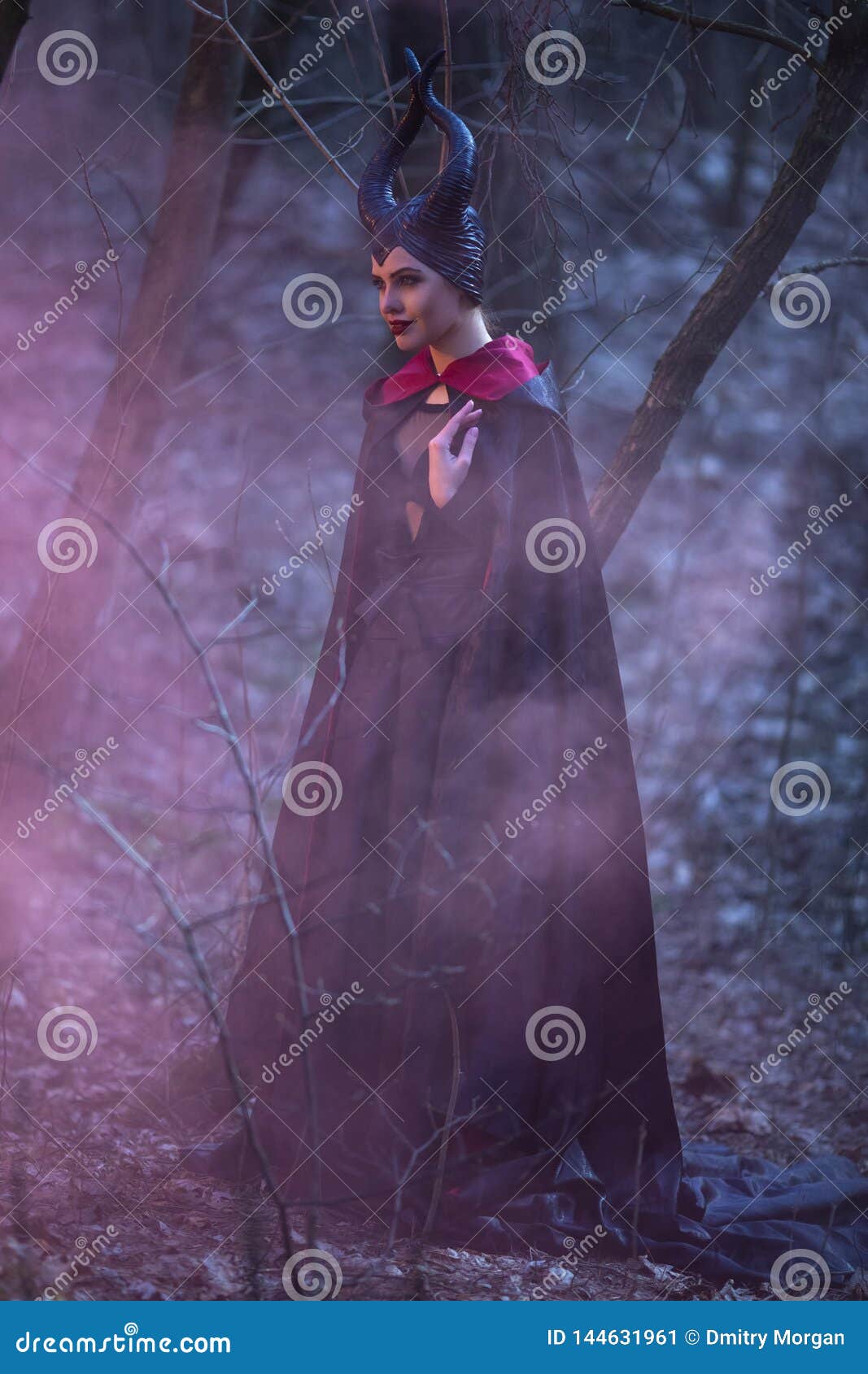 Maleficent Woman With Horns Posing In Spring Empty Forest With Smoky ...