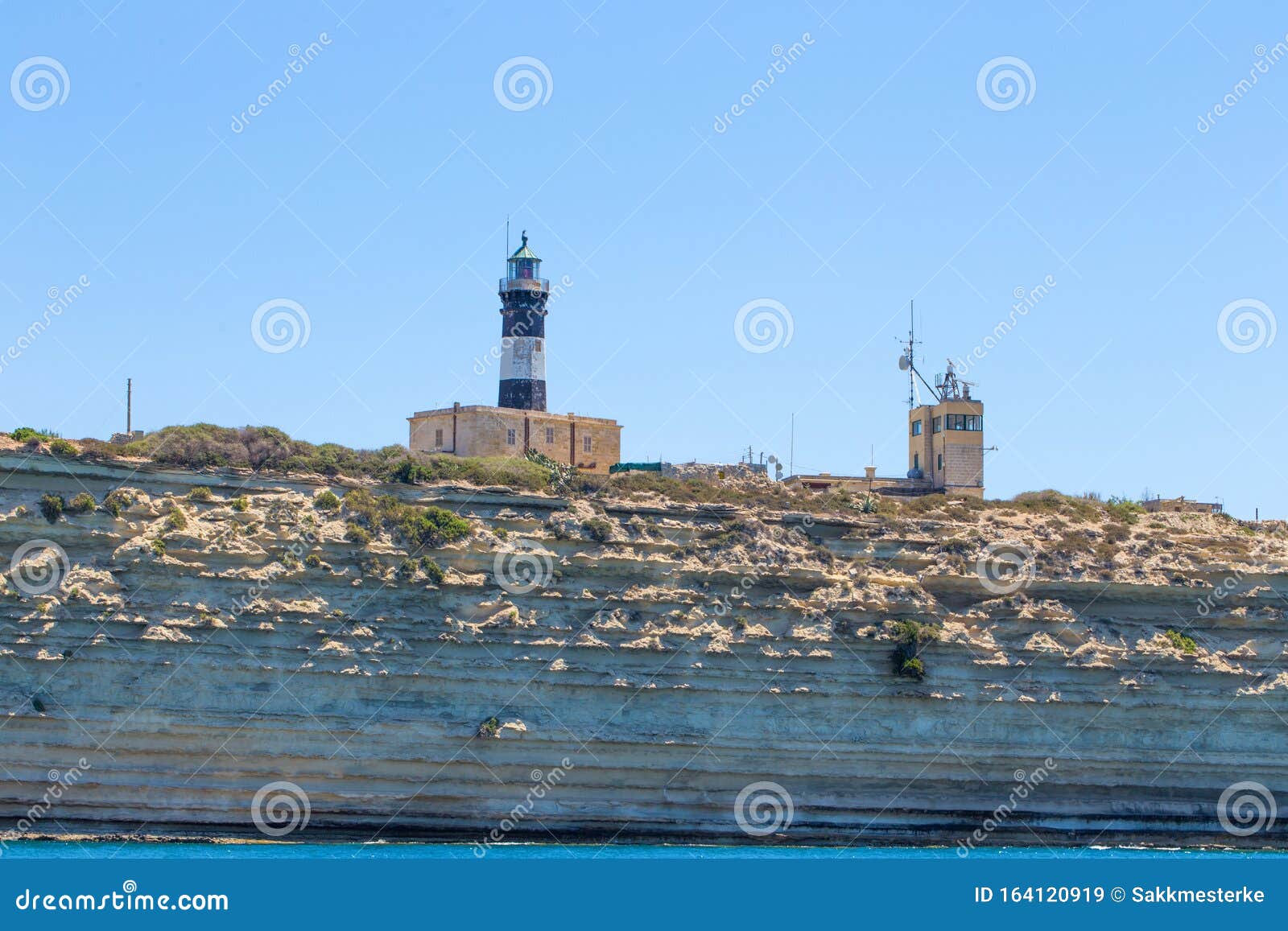 Maltese Bunkers with Lighthouse at Malta Stock Image - Image of blue ...