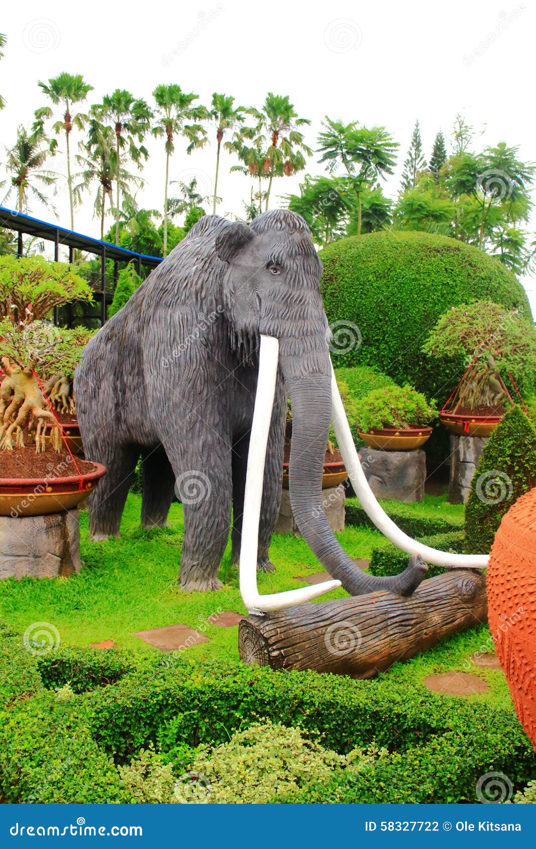 Mammoth statue in garden stock photo. Image of mammoth - 58327722