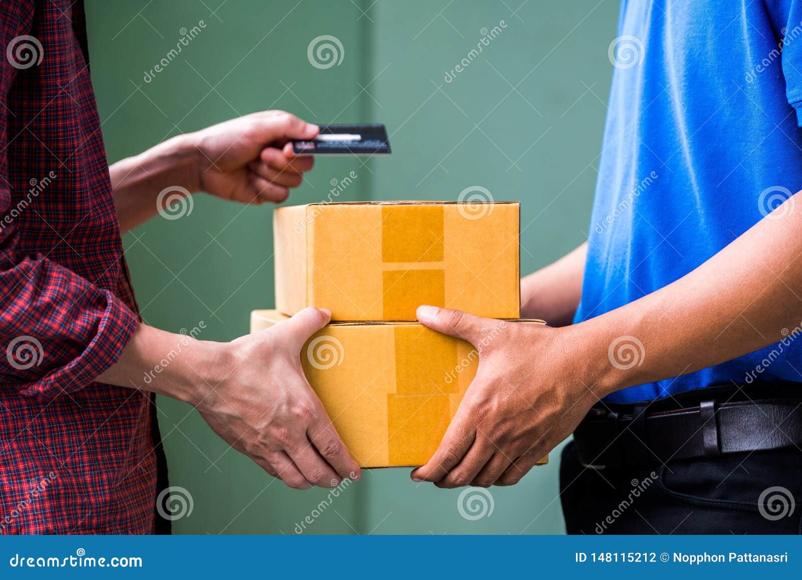 Man Accepting a Delivery of Boxes from Deliveryman. Stock Photo - Image ...