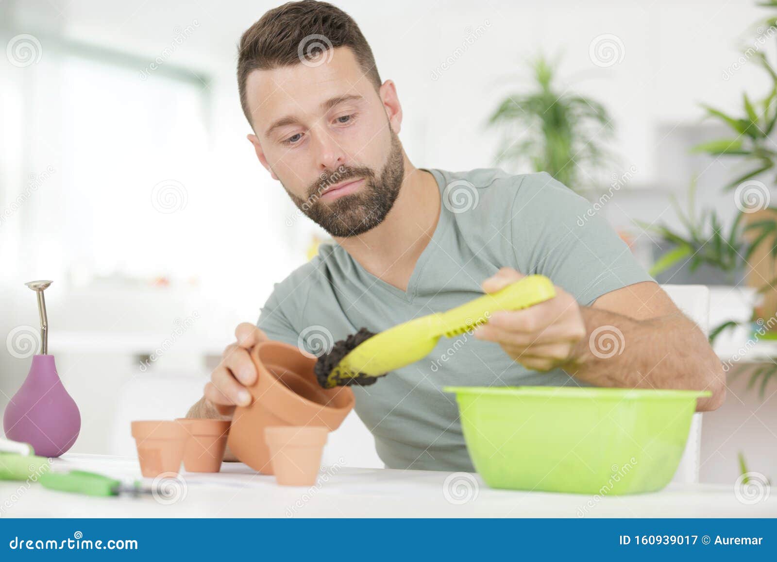 Man adding soil to pot stock image. Image of black, earth - 160939017