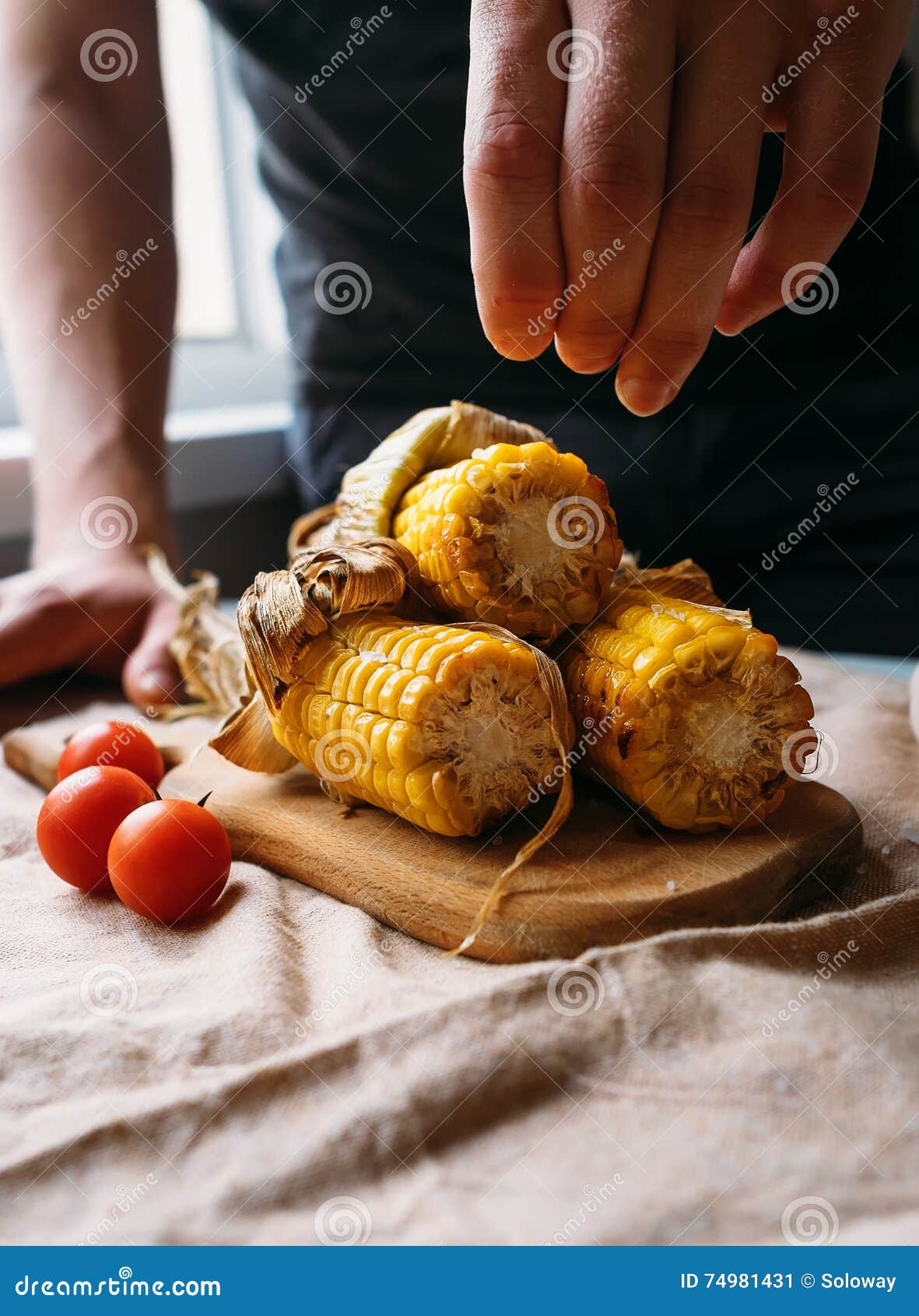 Man Adds Salt on the Roasted Corn Stock Image - Image of adds ...