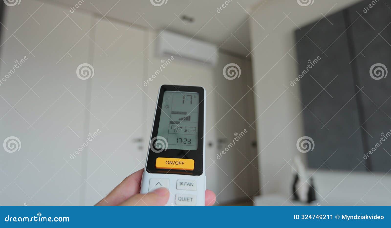 Man Adjust the Temperature on Air Conditioner in the Living Room. Hand ...
