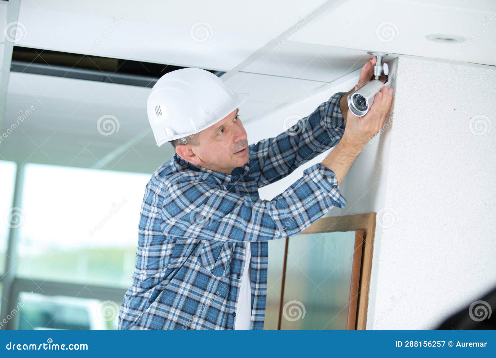 Man adjusting cctv stock image. Image of electrician - 288156257