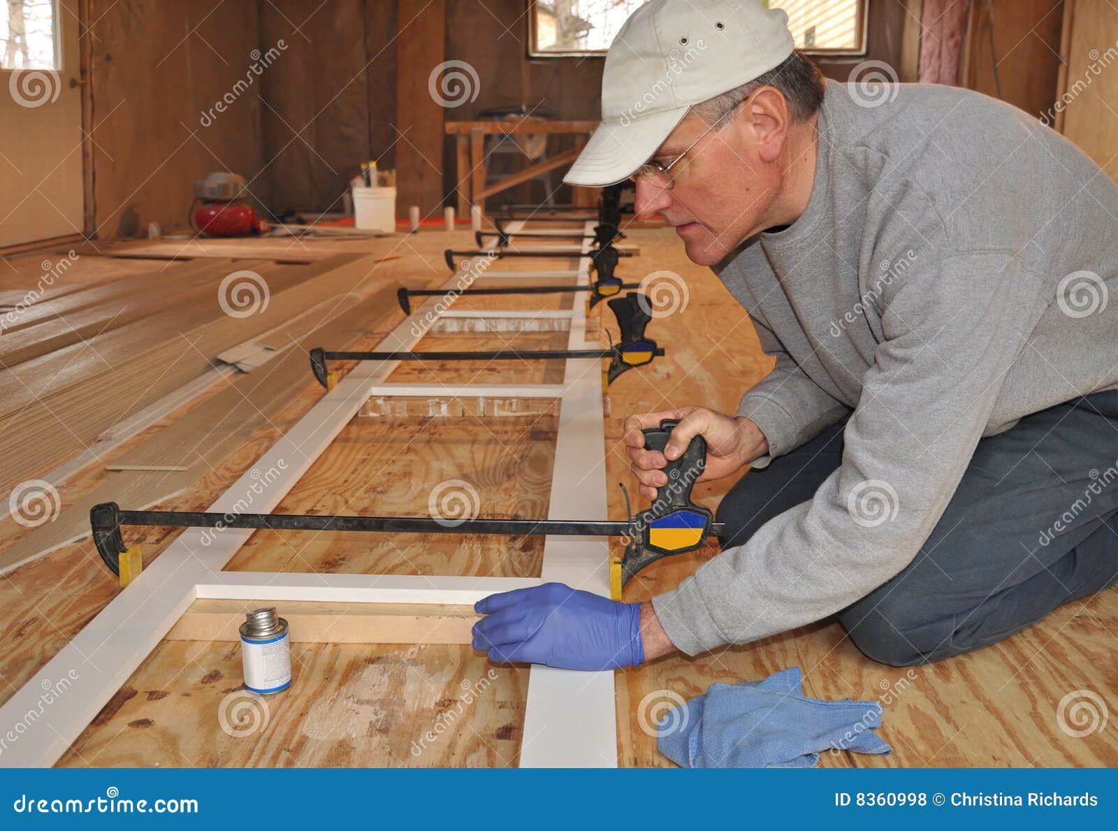 Man Adjusting Clamps on Trim Assembly Stock Photo - Image of worker ...