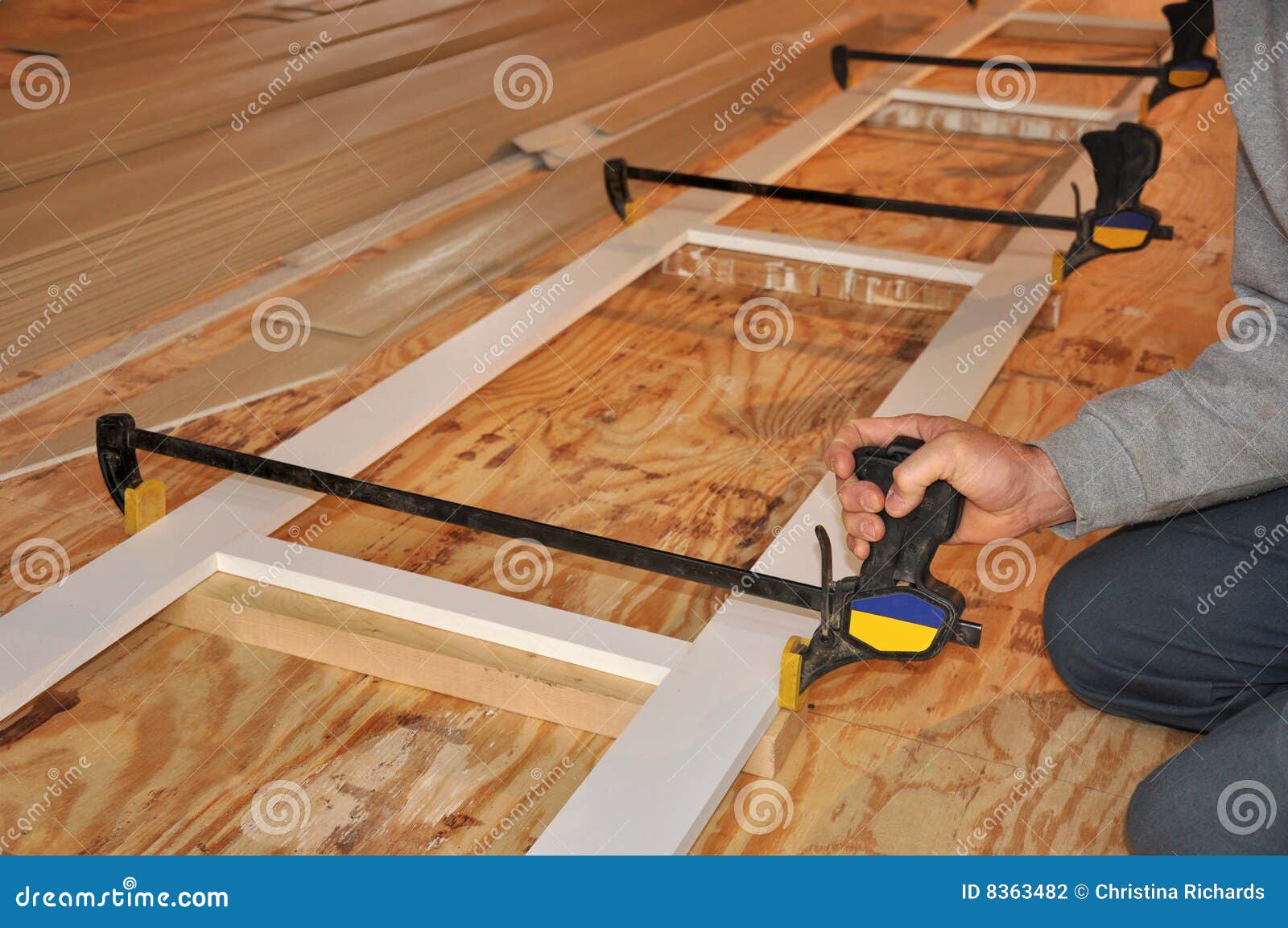 Man Adjusting Clamps on Trim Assembly Stock Photo - Image of craftsman ...