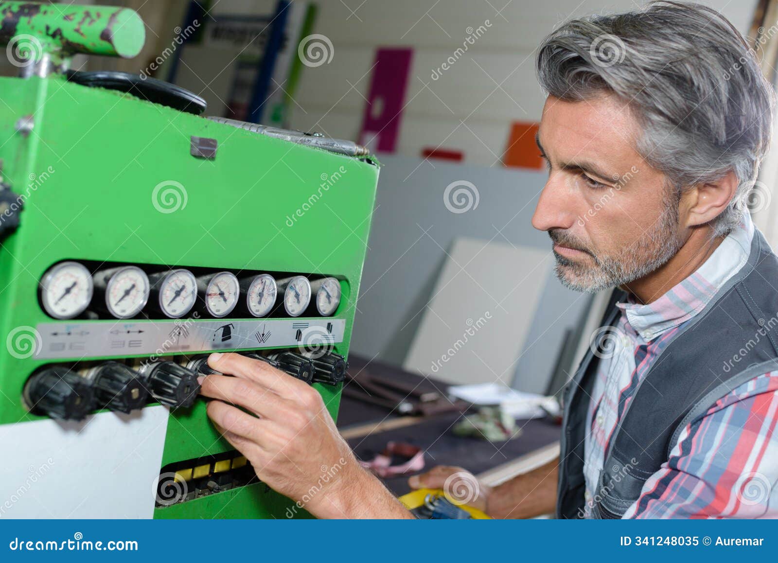 Man Adjusting Dial on Control Panel Stock Image - Image of equipment ...