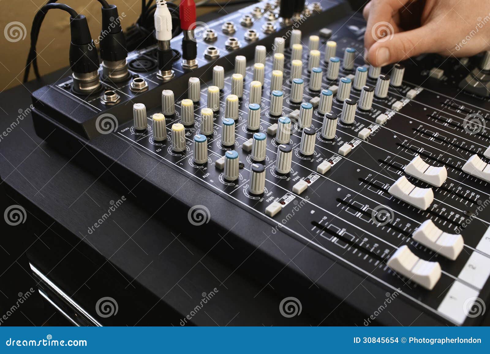 Man Adjusting Knob on Mixing Console Close-up. Stock Photo - Image of ...