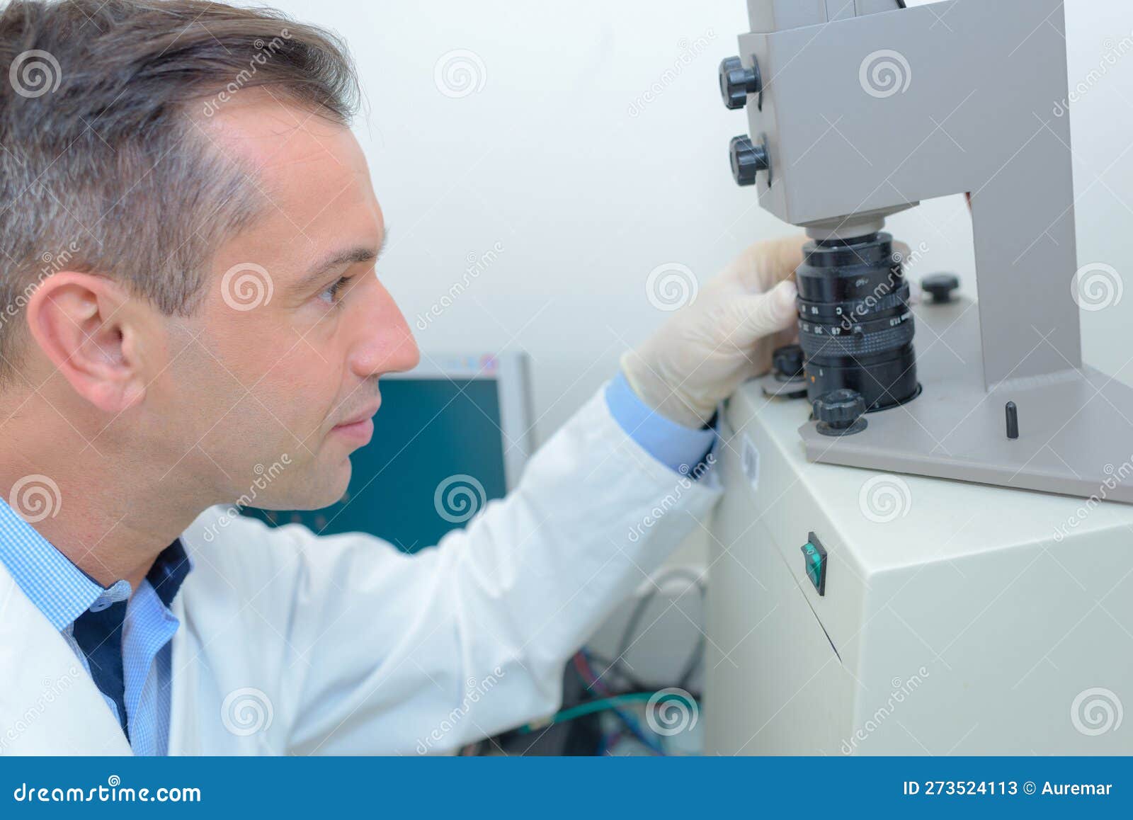 Man Adjusting Lens on Machine Stock Image - Image of medical ...