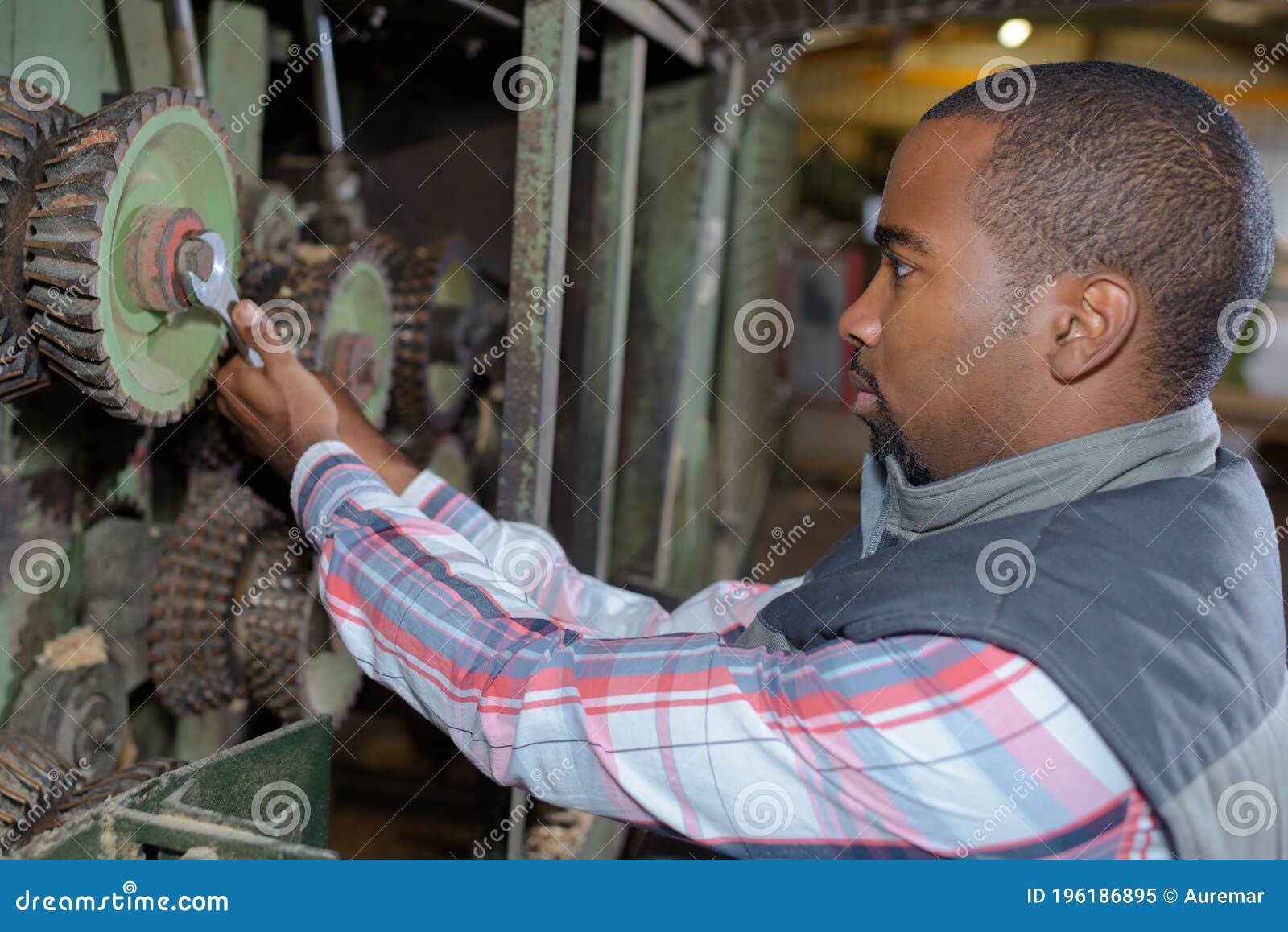 Man adjusting machine stock image. Image of procedure - 196186895