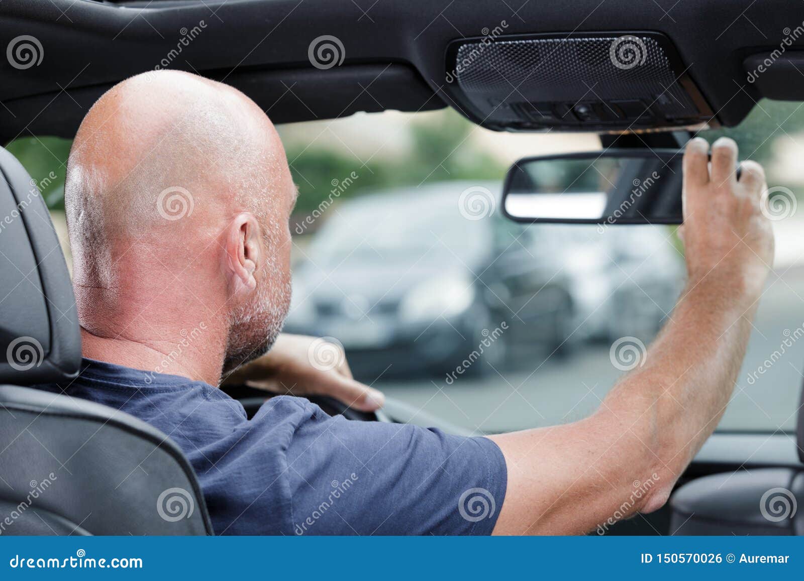 Man Adjusting Rearview Mirror in Car Stock Photo - Image of rear ...